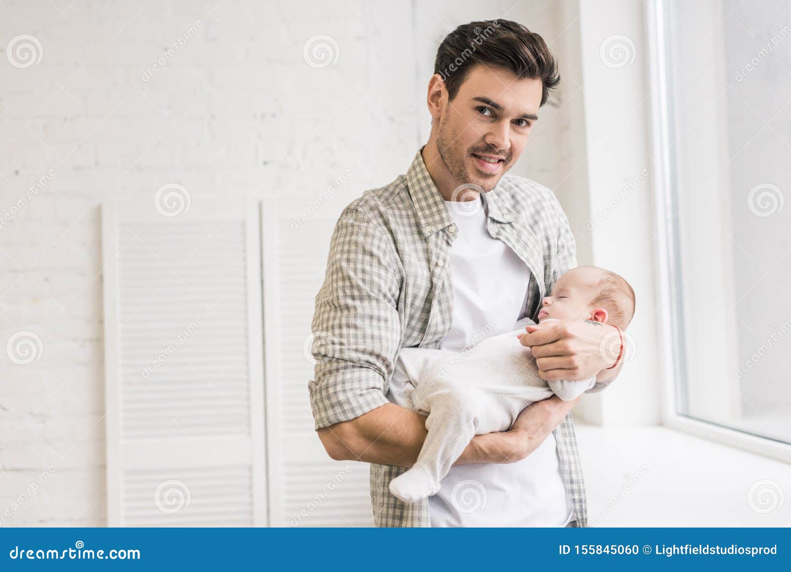 Portrait of Young Man Holding Adorable Sleeping Baby Stock Photo ... Portrait of Young Man Holding Adorable Sleeping Baby Stock Photo ...