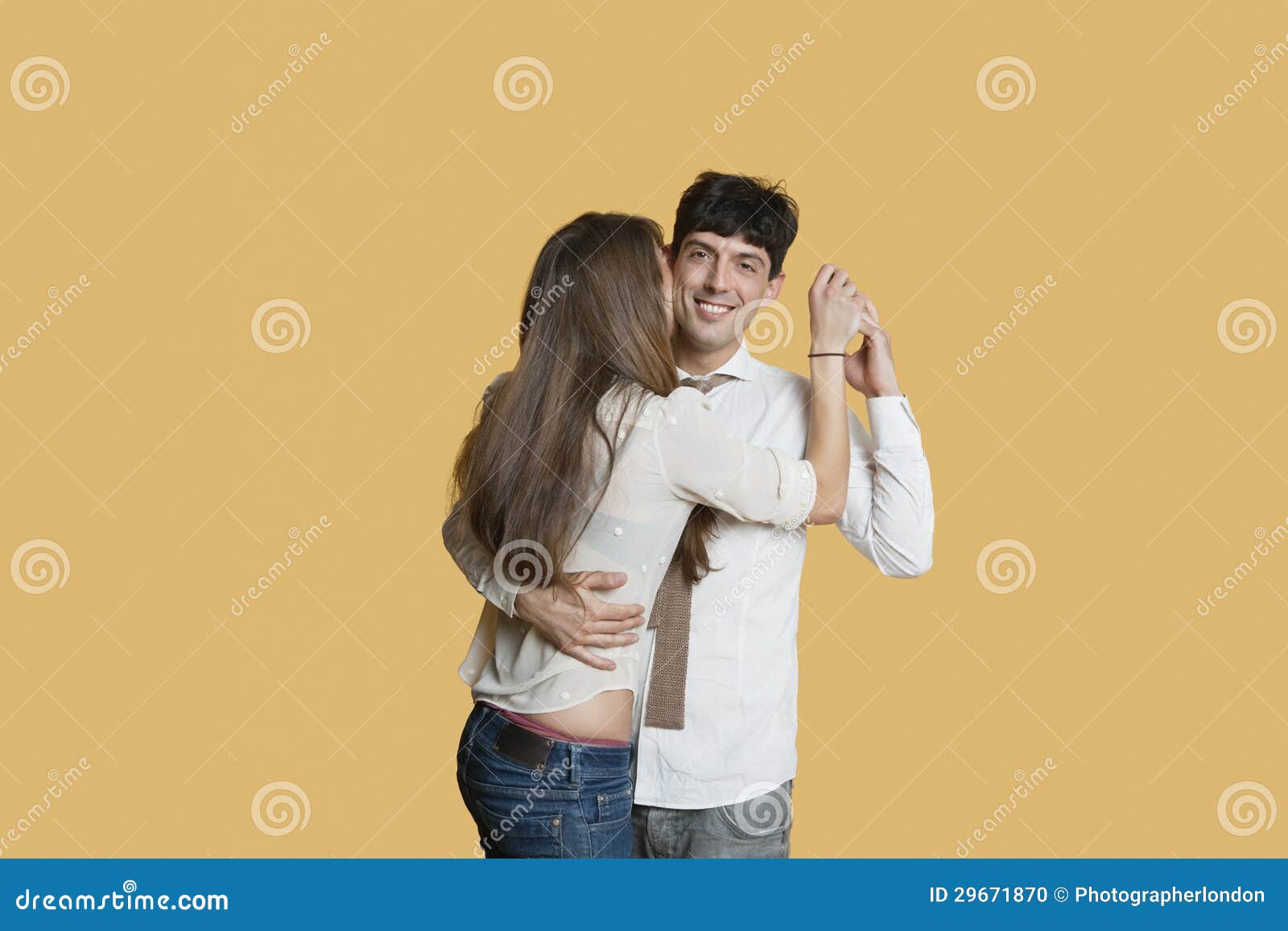 Guy Hugging Girlfriend On Date, Showing Something In Air, Young Couple ...