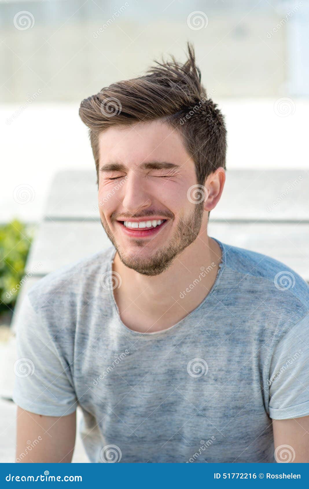Portrait of a Young Man Laghing Stock Photo - Image of hand, bench ...