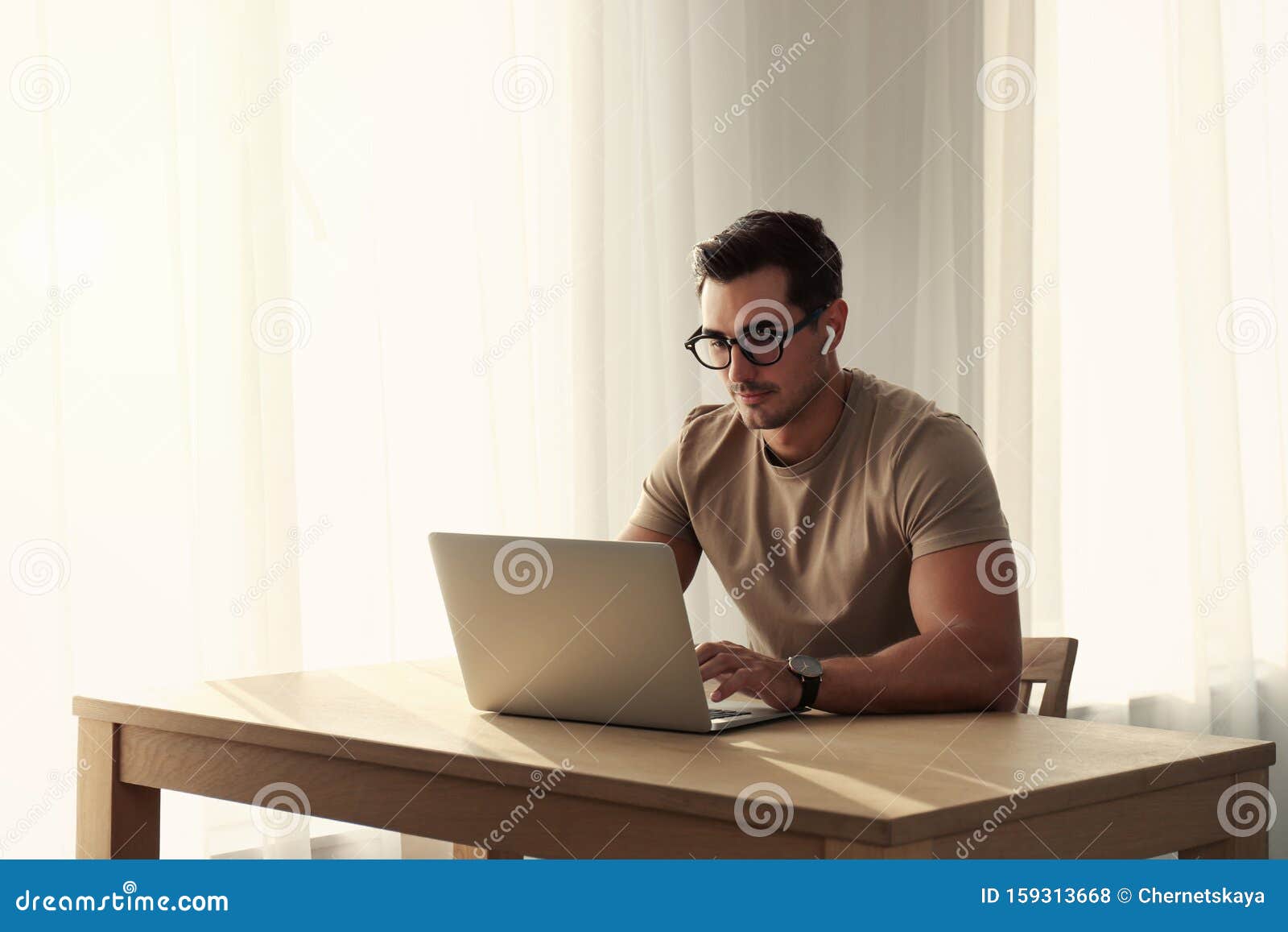 Portrait of Young Man with Laptop at Table Stock Photo - Image of ...