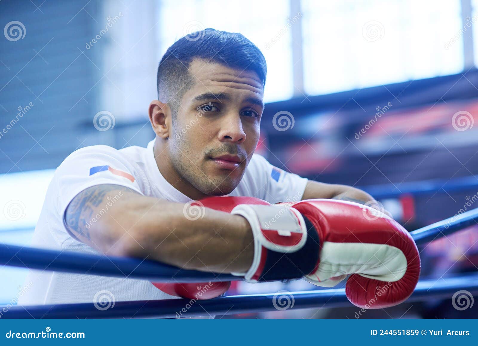 Portrait of a Young Man Leaning on the Ropes while Standing Inside a ...