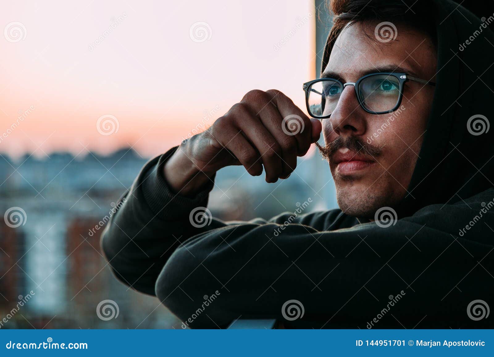 Portrait of a Young Man Looking at Sunset from a Balcony Stock Image ...