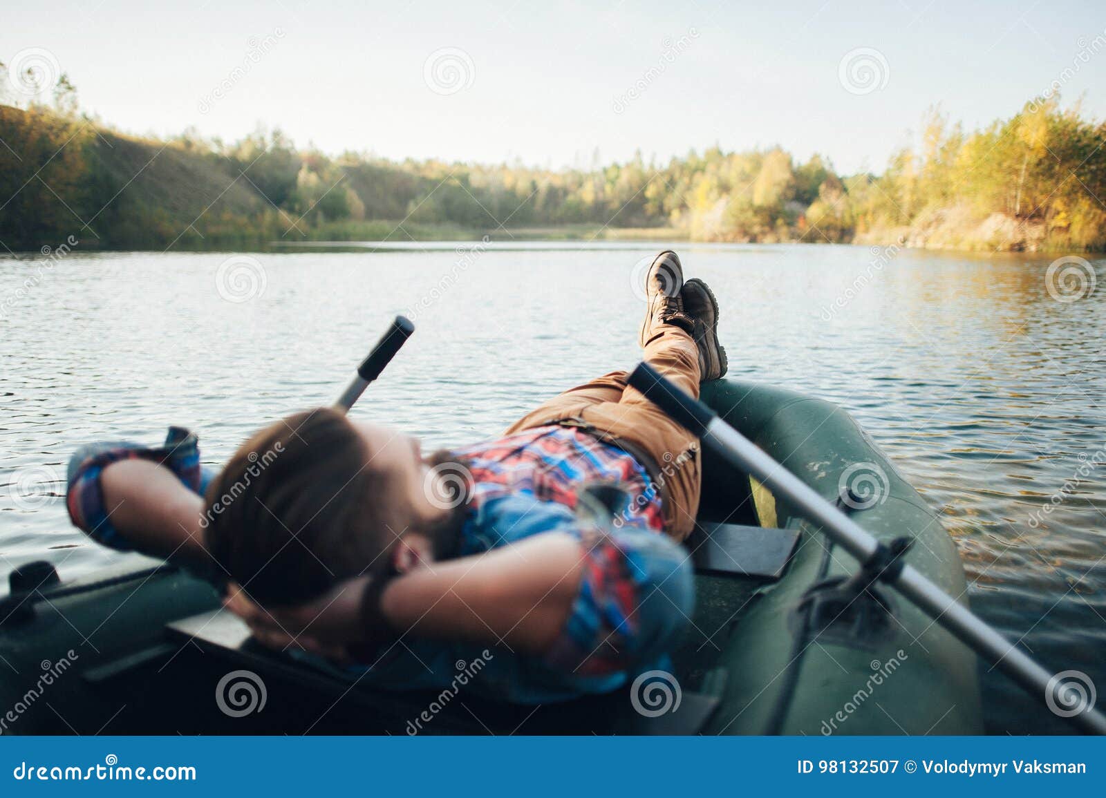 Portrait of Young Man Lying on a Boat Stock Image - Image of mountains ...