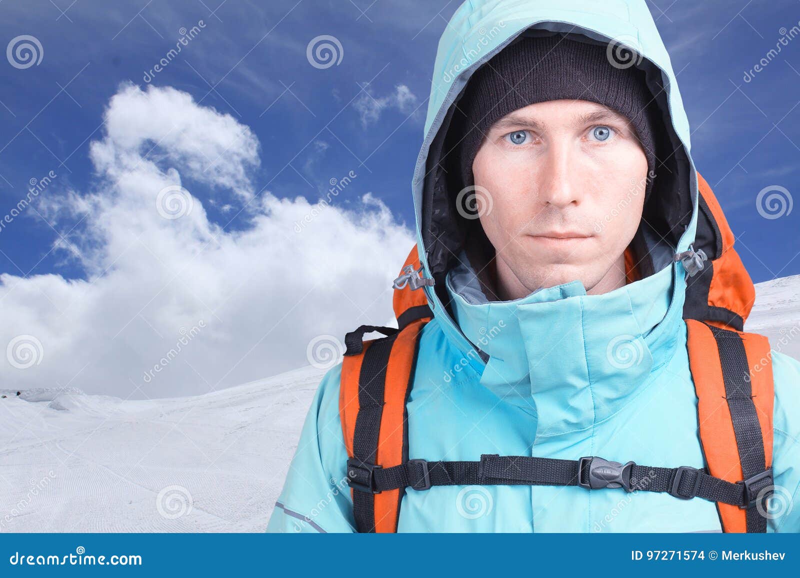 Portrait of Young Man Mountaineer in the Winter Mountains. Blue Sky and ...