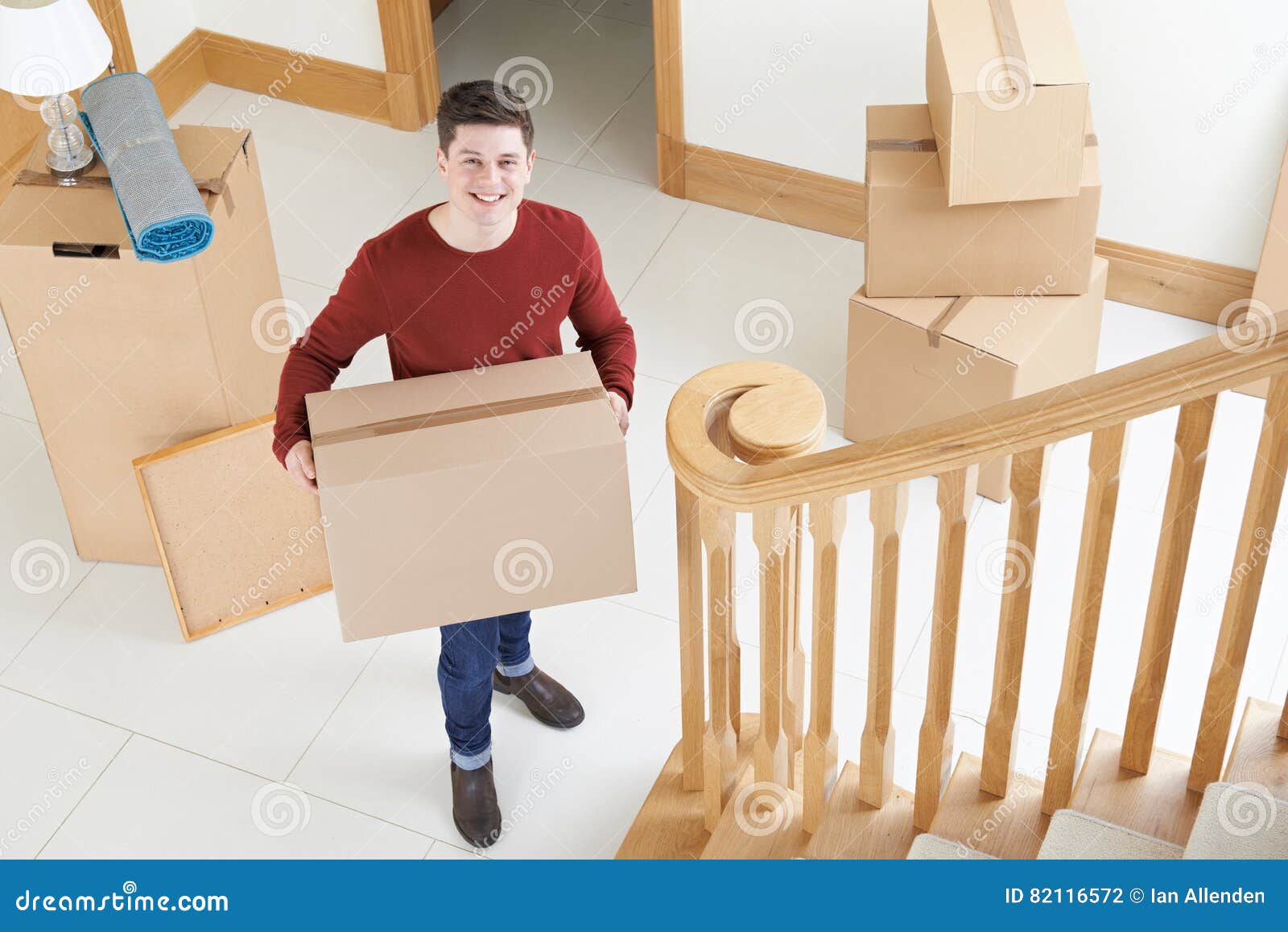 Portrait of Young Man Moving into New Home Stock Photo - Image of ...
