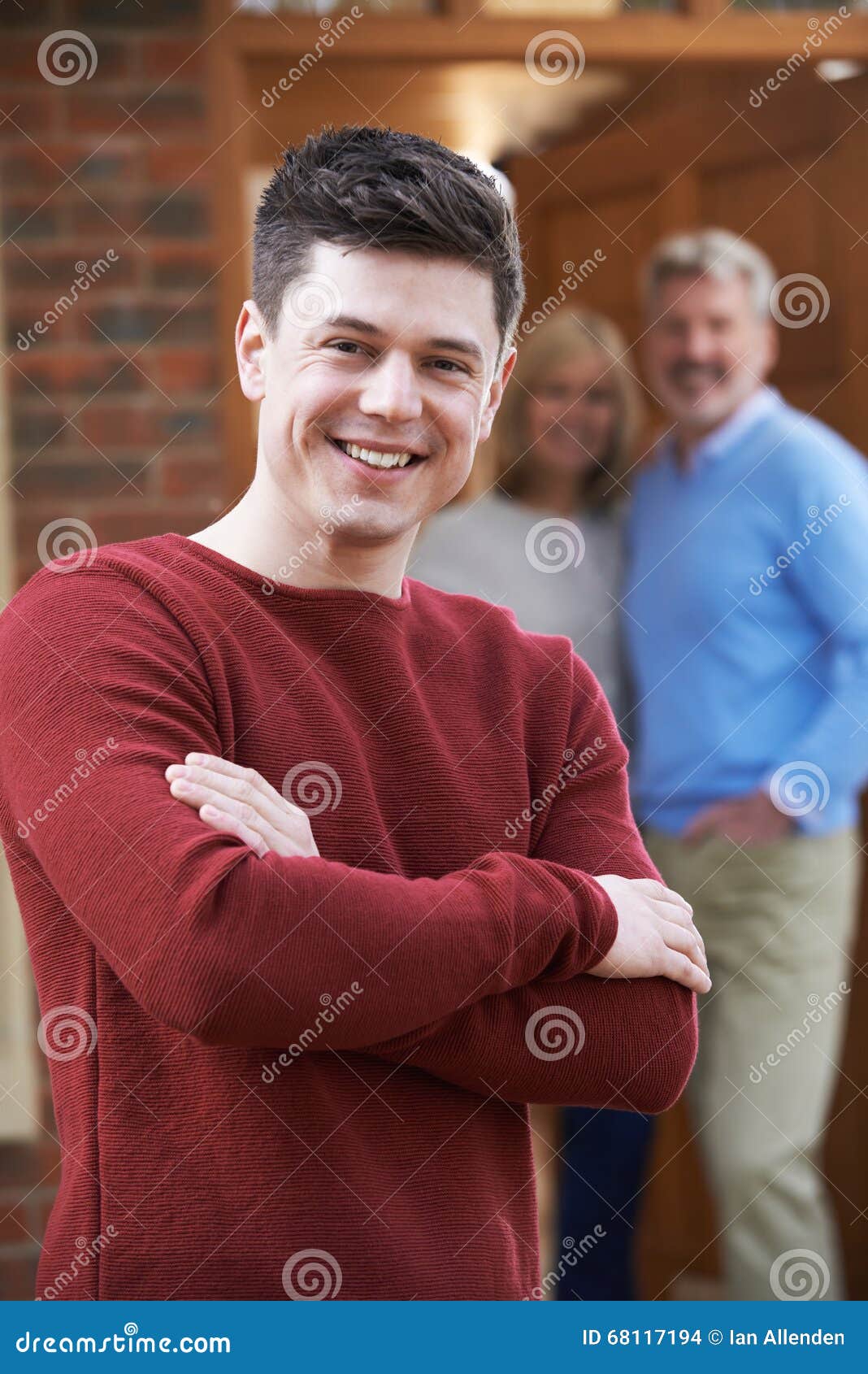 Portrait of Young Man with Parents at Home Stock Photo - Image of door ...