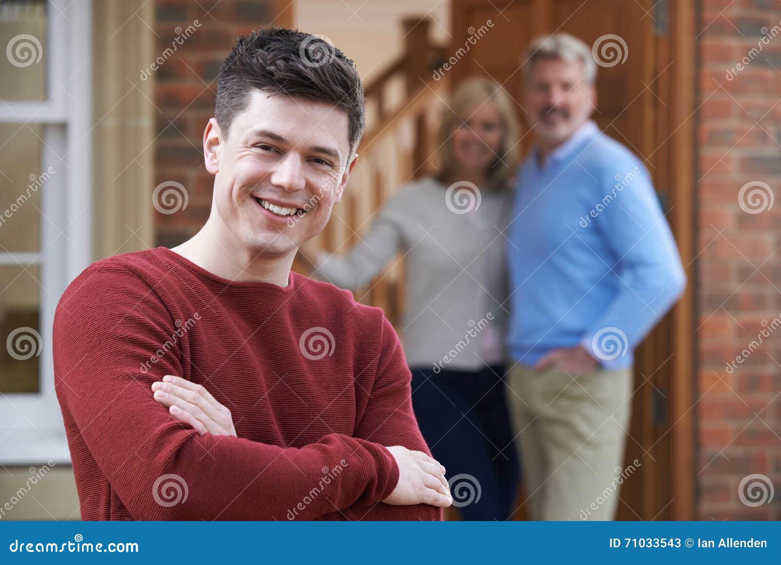 Portrait of Young Man with Parents at Home Stock Image - Image of happy ...