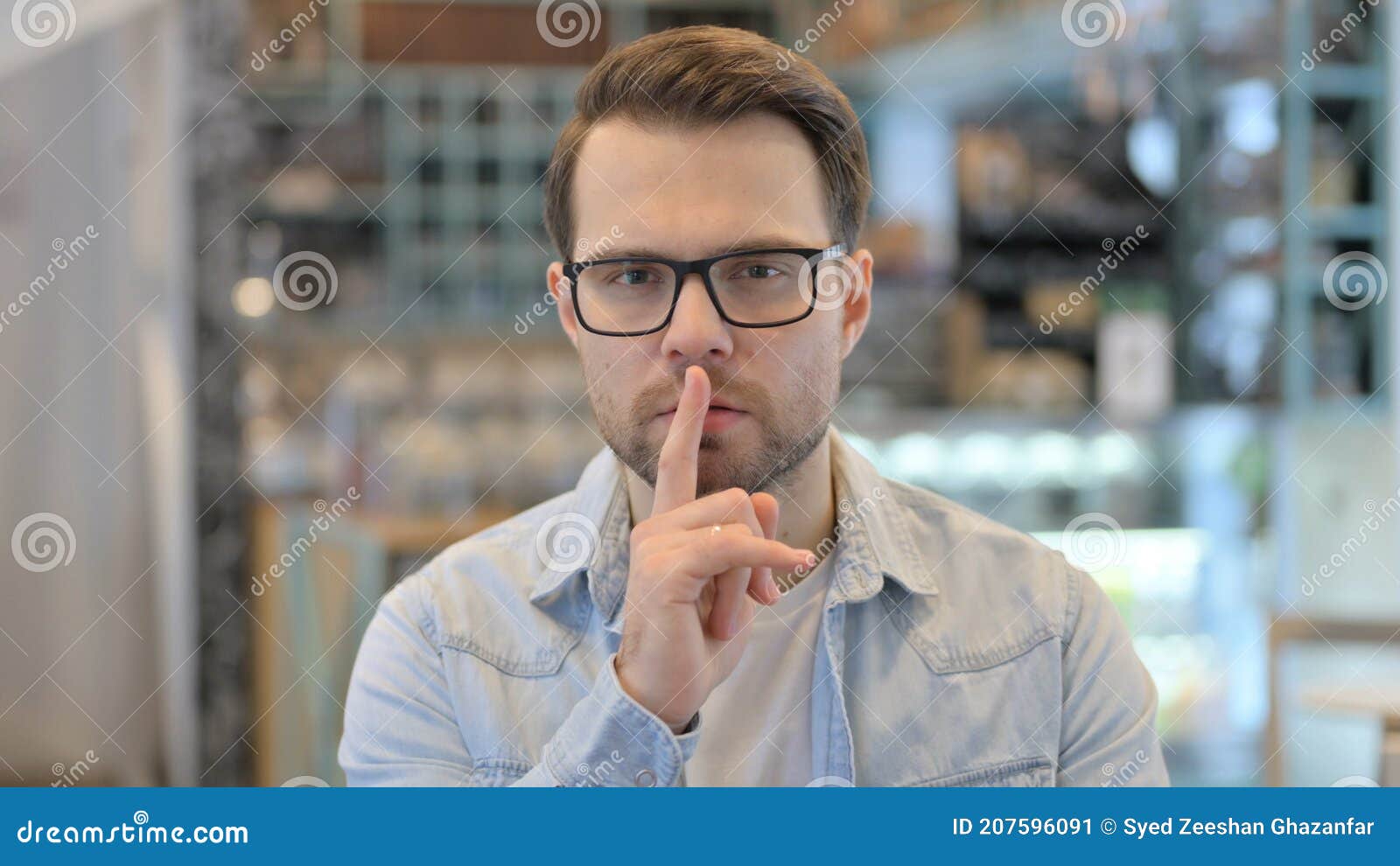 Portrait of Young Man Putting Finger on Lips, Quiet Sign Stock Image ...