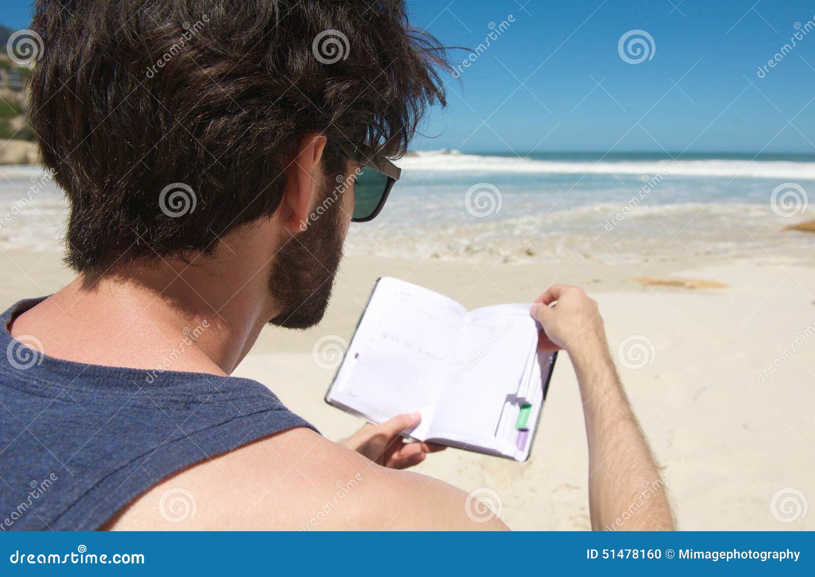 Portrait of a Young Man Reading Book at the Beach Stock Photo - Image ...