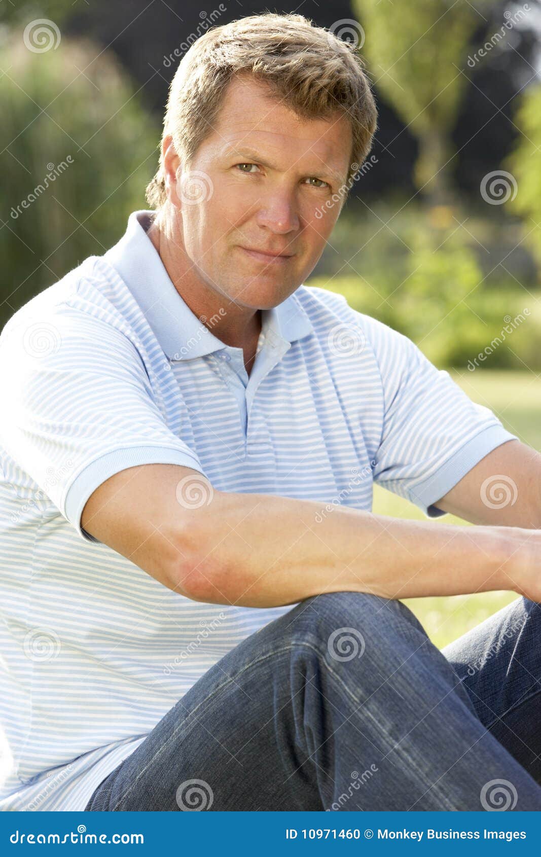 Portrait of Young Man Relaxing in Countryside Stock Photo - Image of ...