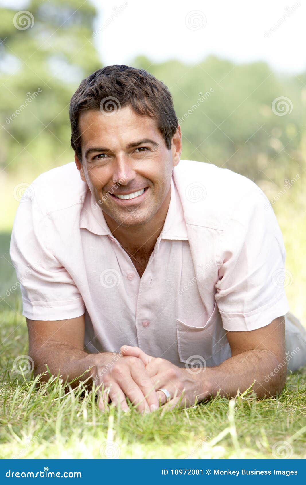 Portrait of Young Man Relaxing in Countryside Stock Image - Image of ...