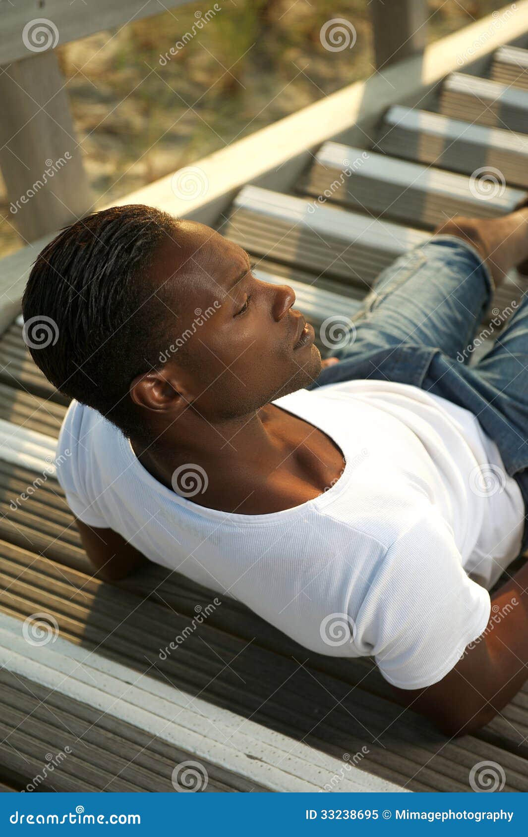 Portrait of a Young Man Sitting Alone Outdoors Stock Image - Image of ...