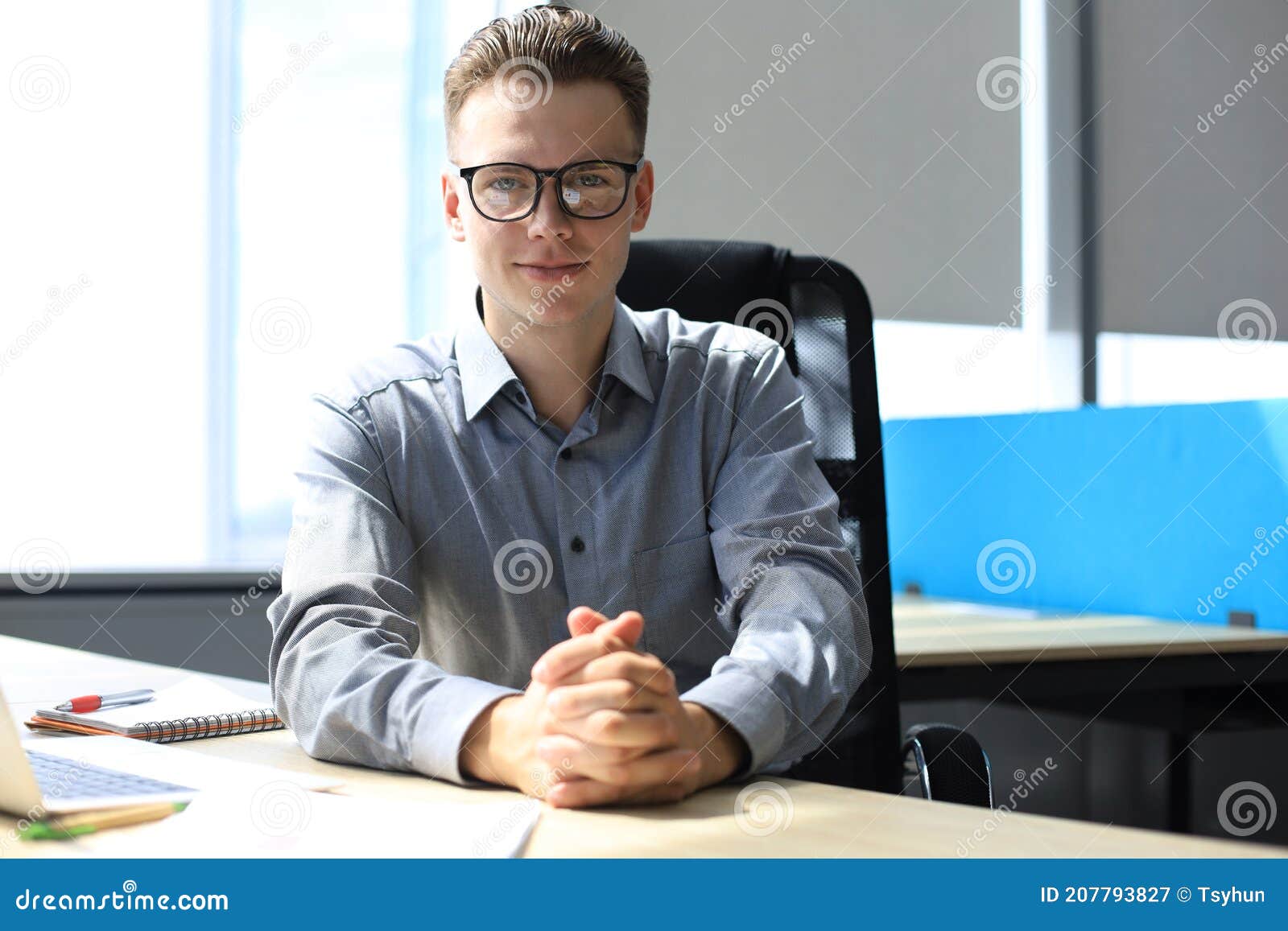 Portrait of Young Man Sitting at His Desk in the Office Stock Image ...
