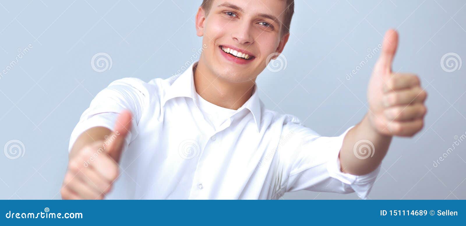 Portrait of Young Man Smiling Sitting on Gray Background. Portrait of ...