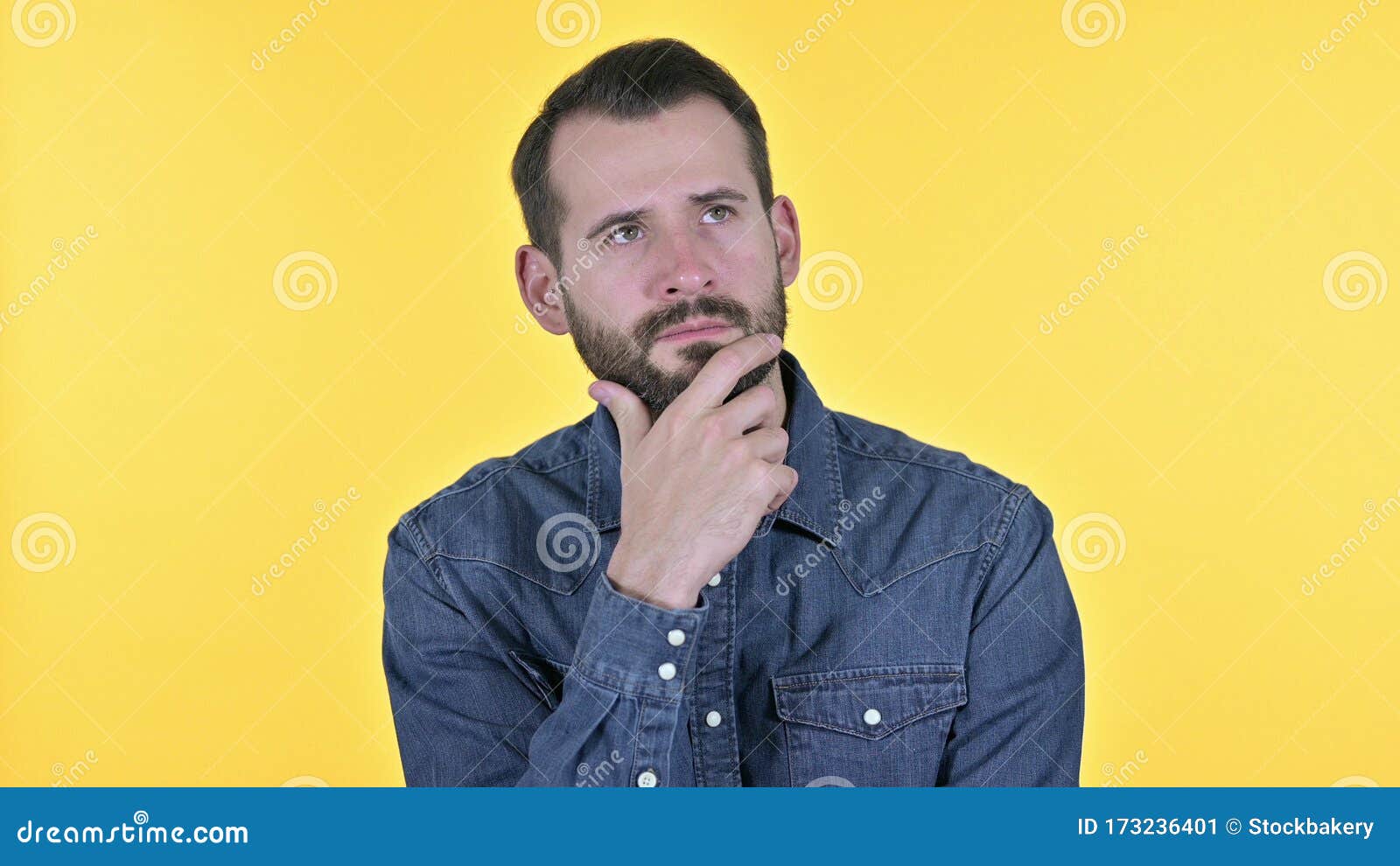 The Portrait of Young Man Thinking about Idea, Yellow Background Stock ...