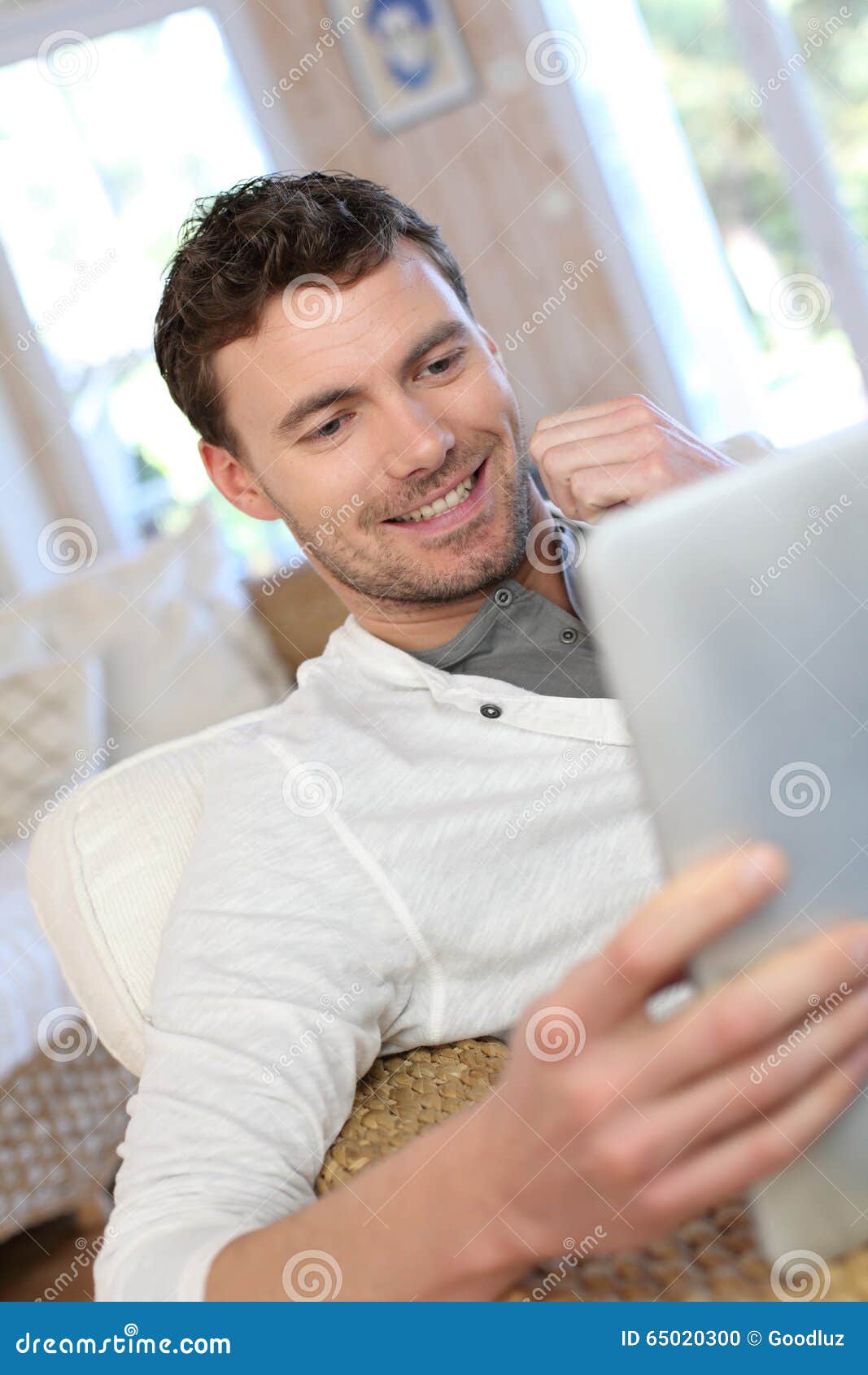 Portrait of Young Man Using Tablet Stock Photo - Image of smile, chat ...