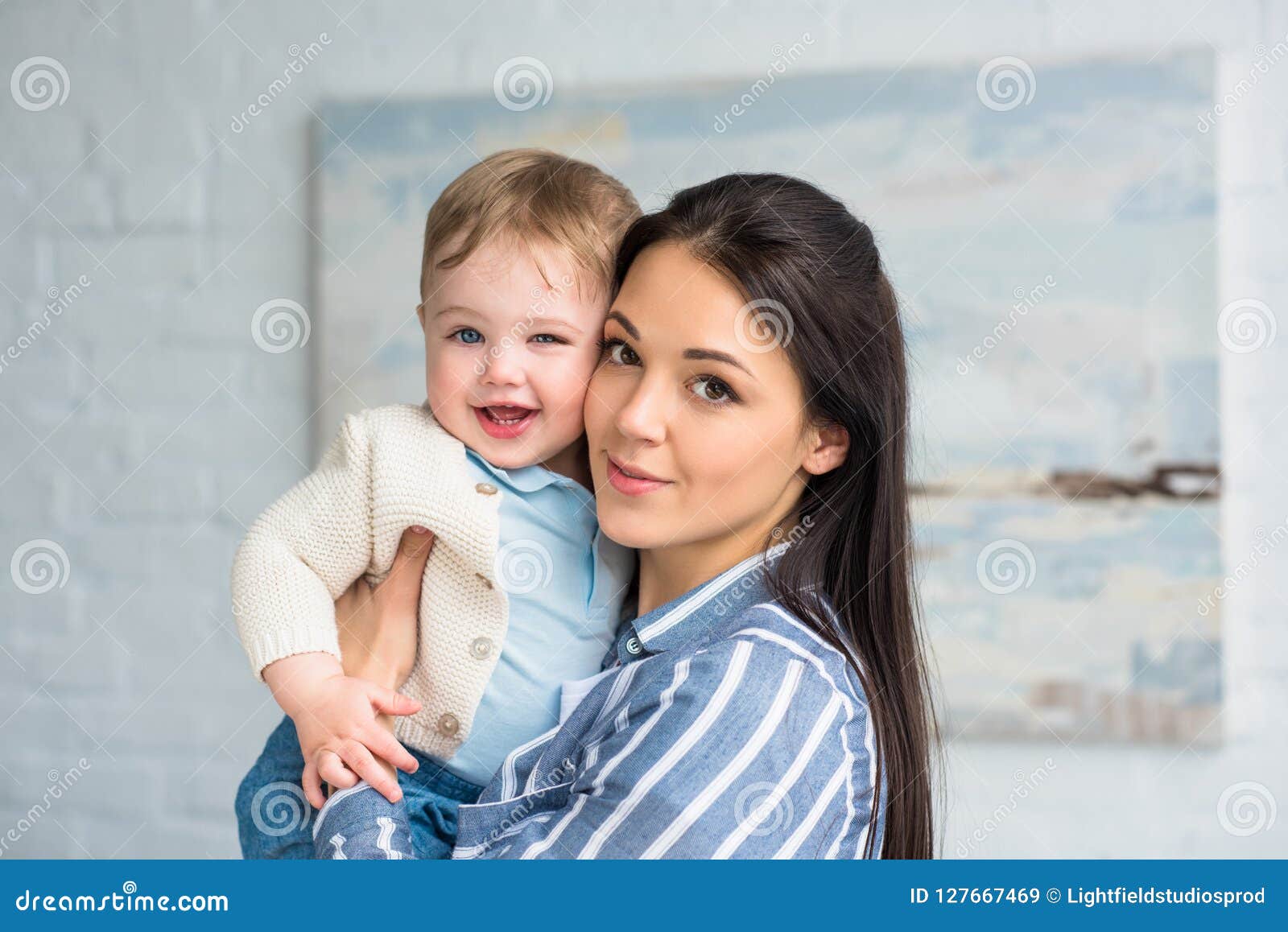 Portrait of Young Mother Holding Cheerful Adorable Baby Boy Stock Image ... Portrait of Young Mother Holding Cheerful Adorable Baby Boy Stock Image ...