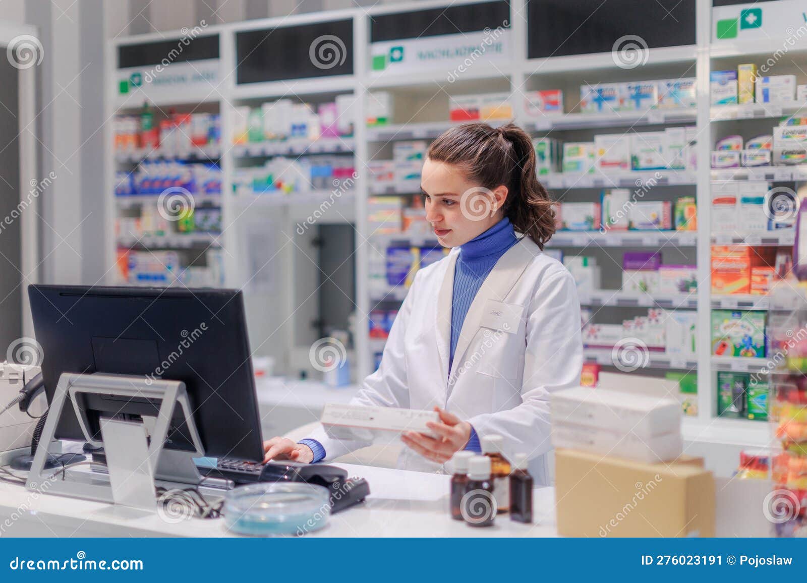 Portrait of Young Pharmacist Selling Medication in Pharmacy. Stock ...