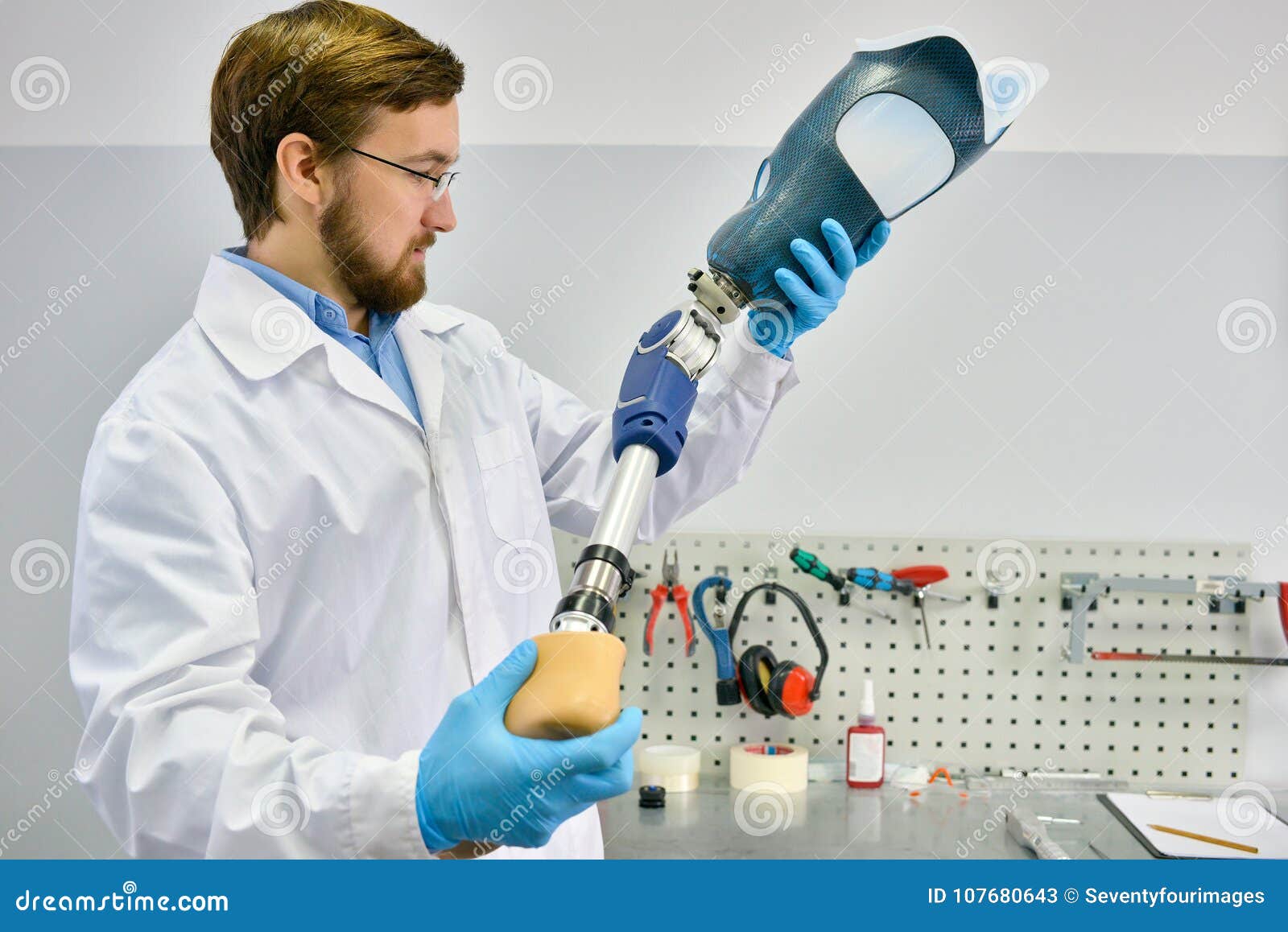 Young Prosthetist Holding Artificial Leg Stock Image - Image of ...
