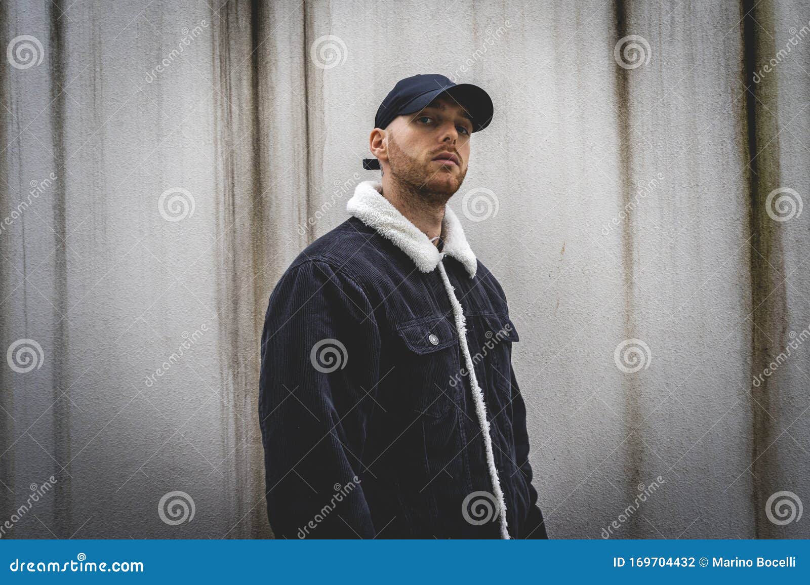 Portrait of Young Rapper Posing in Front of a White Wall Stock Photo ...