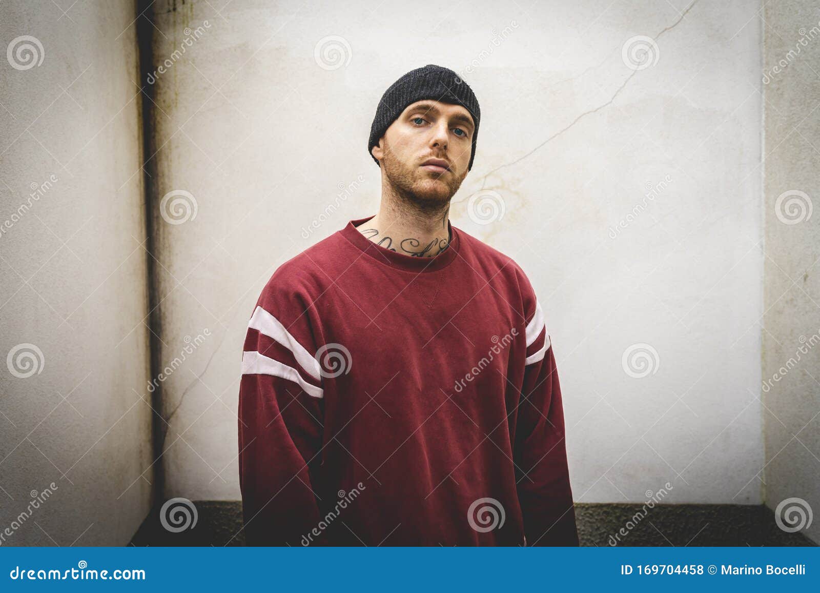 Portrait of Young Rapper Posing in Front of a White Wall Stock Photo ...