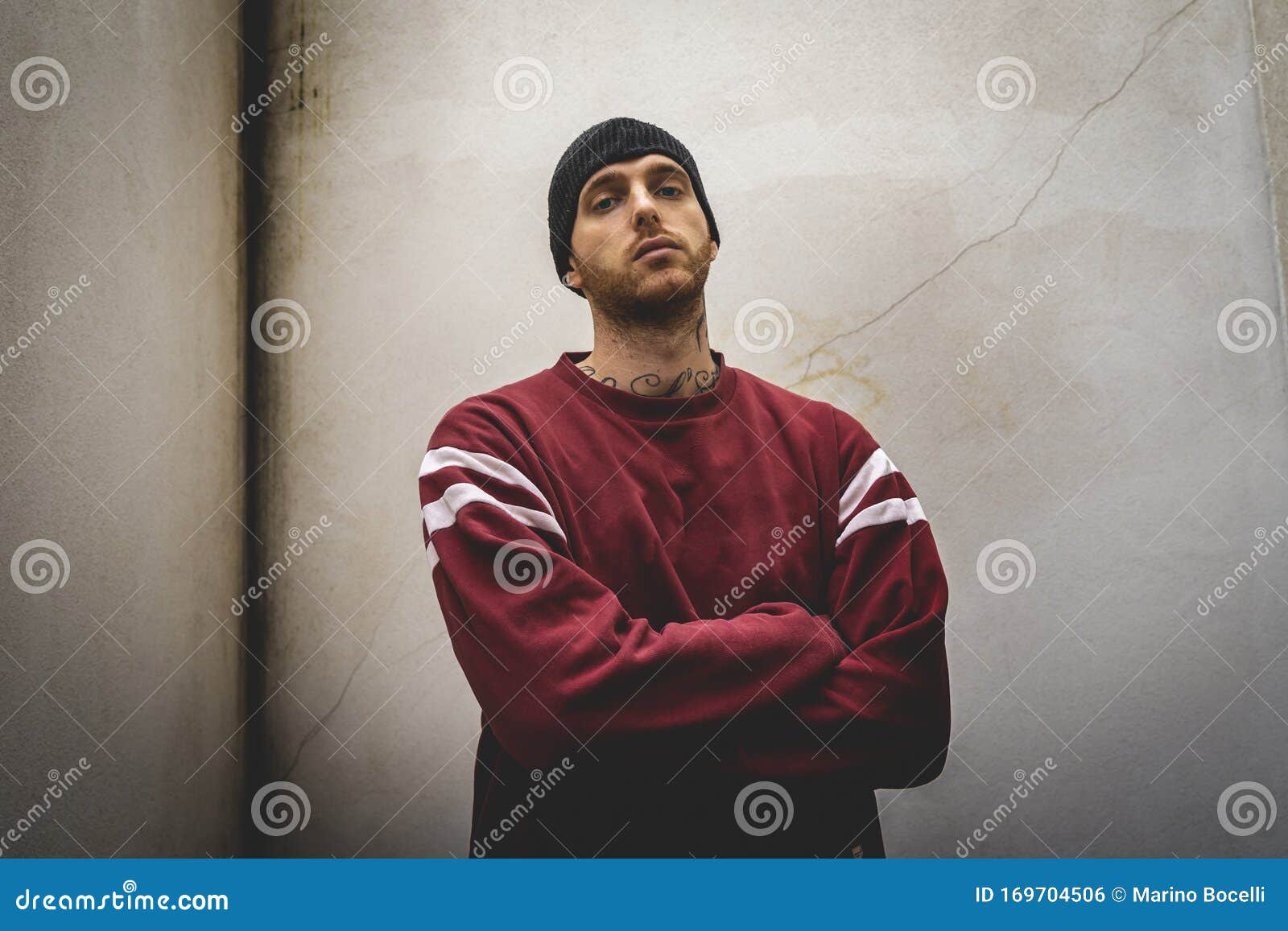 Portrait of Young Rapper Posing in Front of a White Wall Stock Photo ...