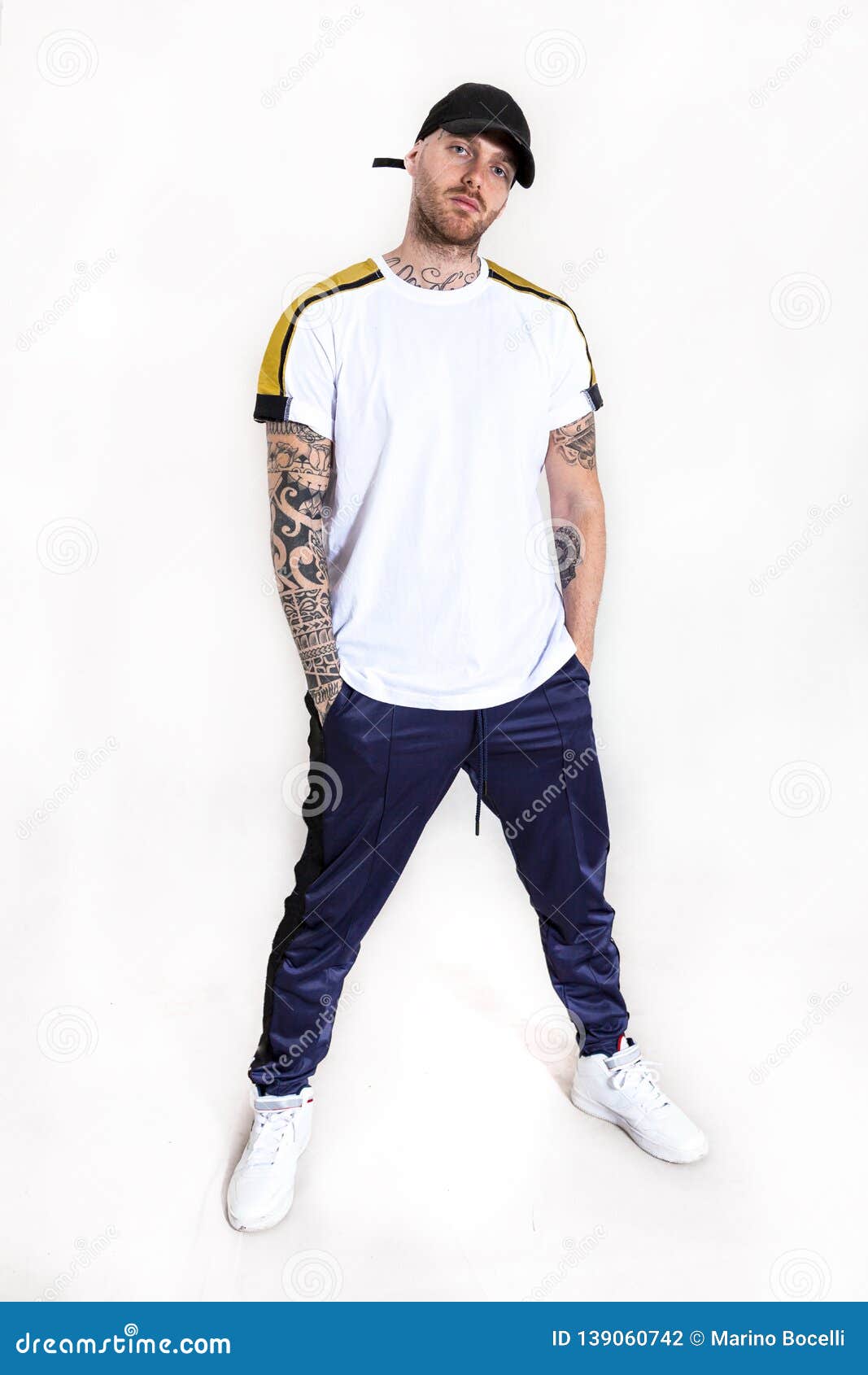The Young Man In Rapper Clothes Stock Photo | CartoonDealer.com #5447424