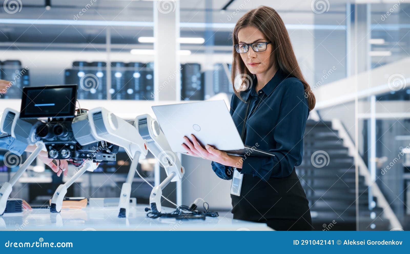 Portrait of a Young Robotics Engineer Using Laptop Computer, Analyzing ...