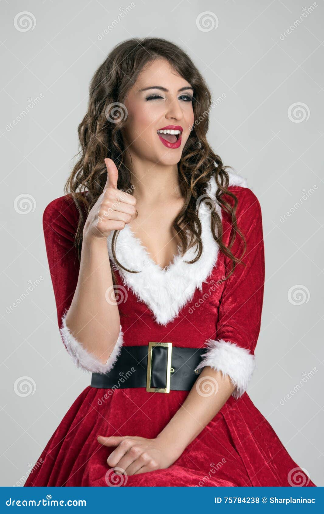 Portrait of Young Santa Female Helper Winking with Thumbs Stock Photo ... Portrait of Young Santa Female Helper Winking with Thumbs Stock Photo ...