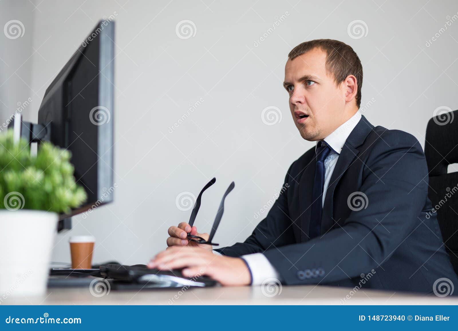 Portrait of Young Shocked Business Man Using Computer in Modern Office ...