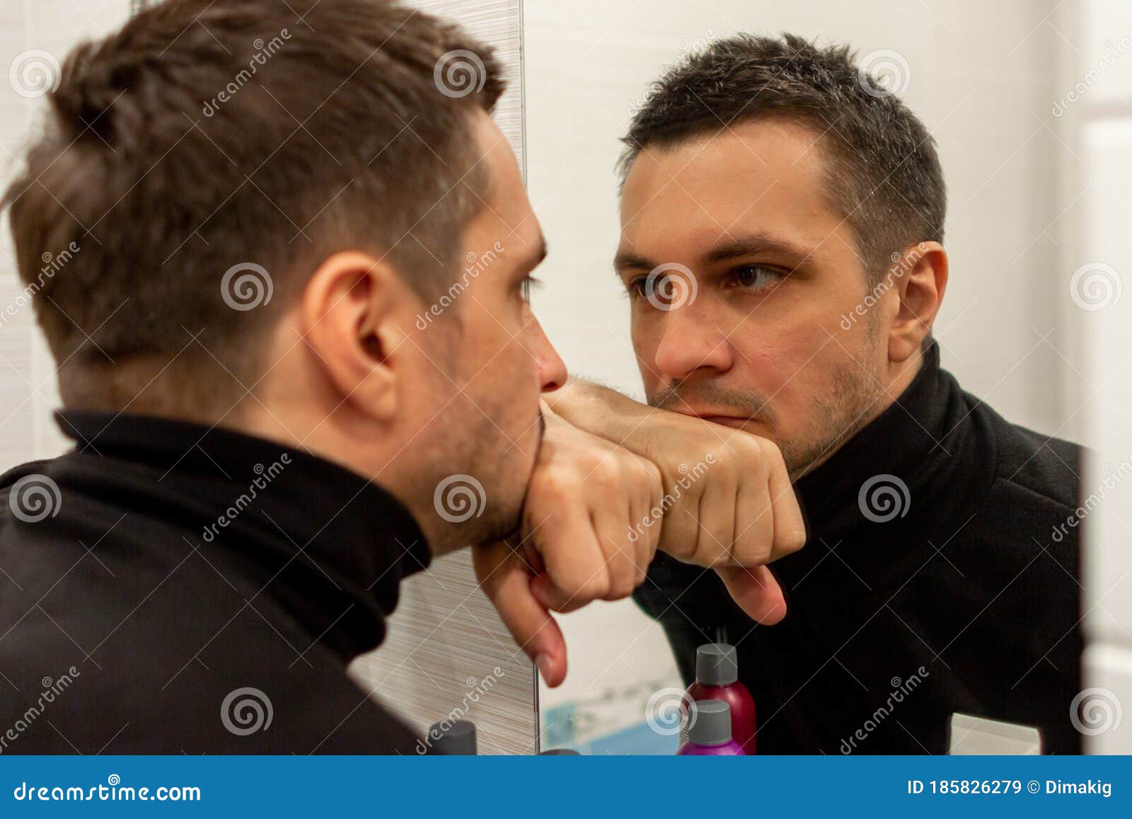 Portrait Of A Young Short Haired Man Wearing Black Turtleneck And