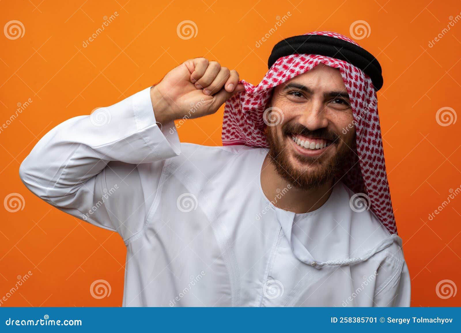 Portrait of Young Smiling Arab Man on Orange Background Stock Image ...