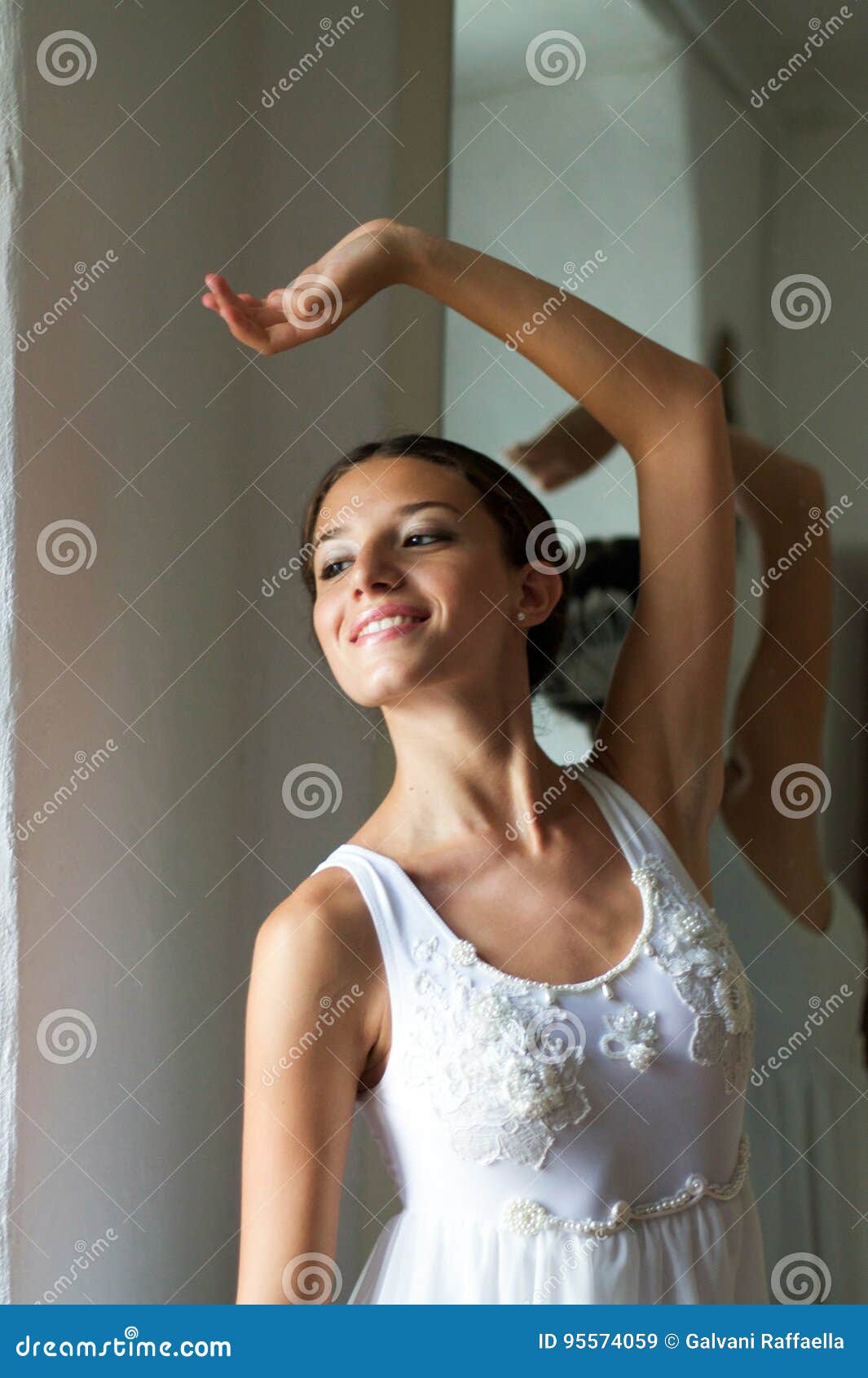 Portrait of Young Smiling Ballet Dancer in White Costume As a Br Stock ...
