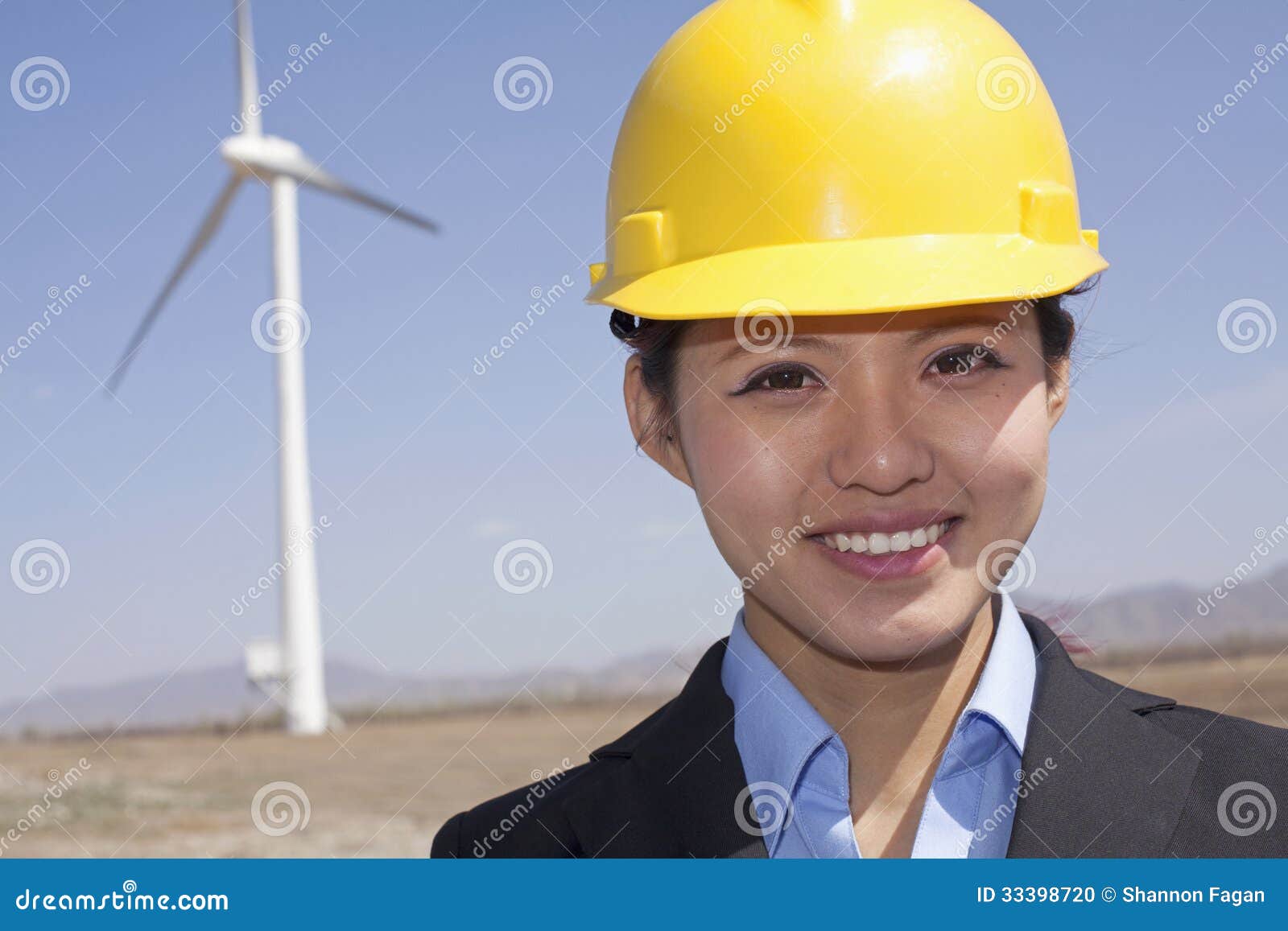 Portrait of Young Smiling Female Engineer Checking Wind Turbines on ...