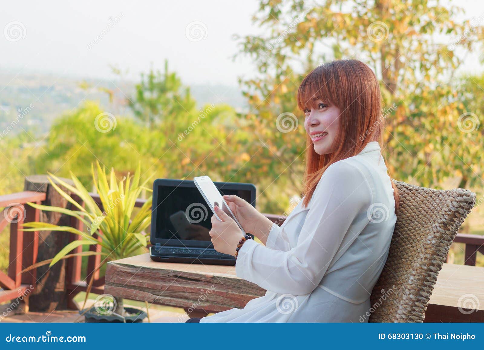 Portrait of a Young Smiling Female Freelancer Using Tablets Stock Photo ...