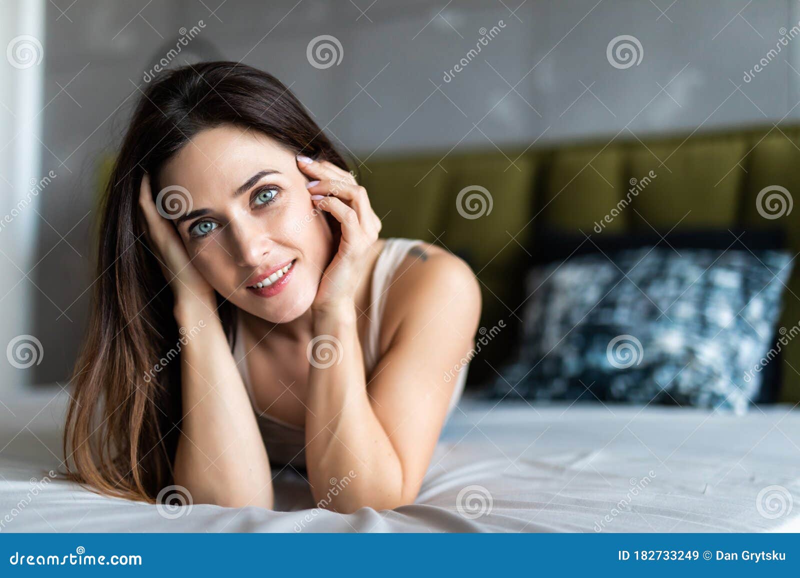 Portrait of Young Smiling Woman Lying on Bed Stock Image - Image of ...