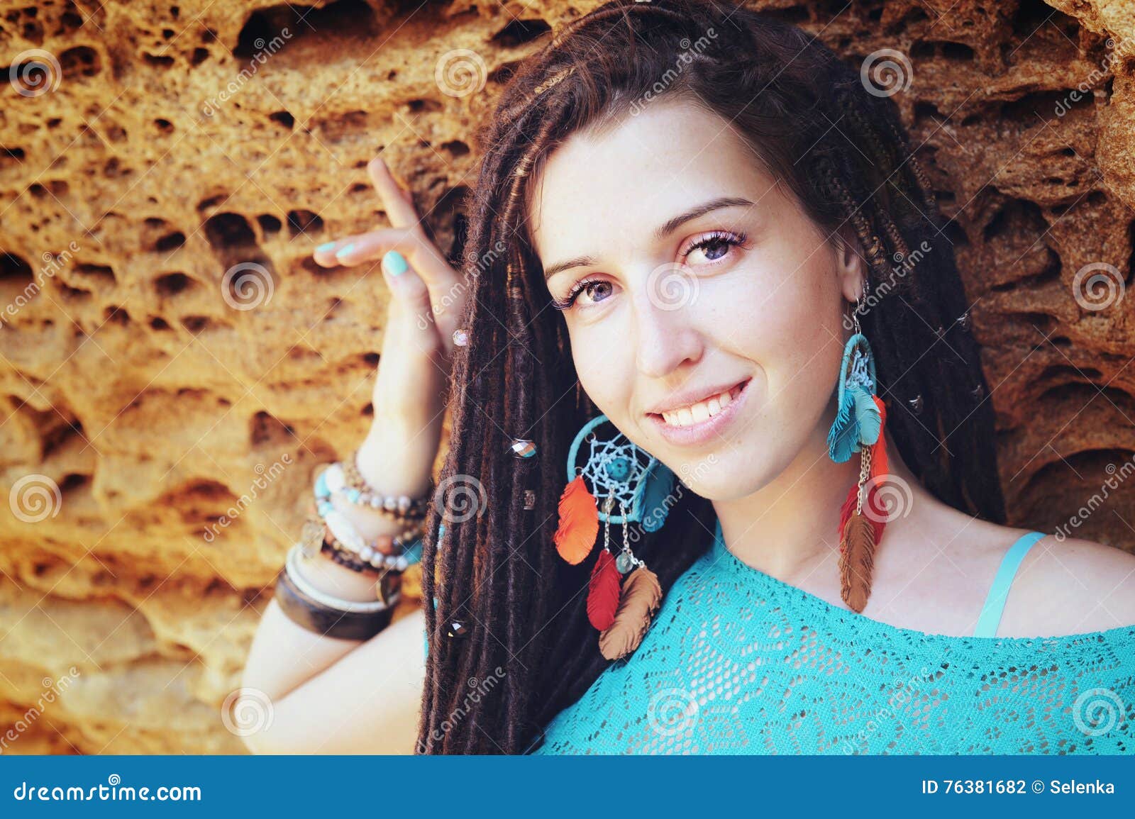 Portrait Of A Young Smiling Woman Wearing Dreadlocks Hairstyle Dressed
