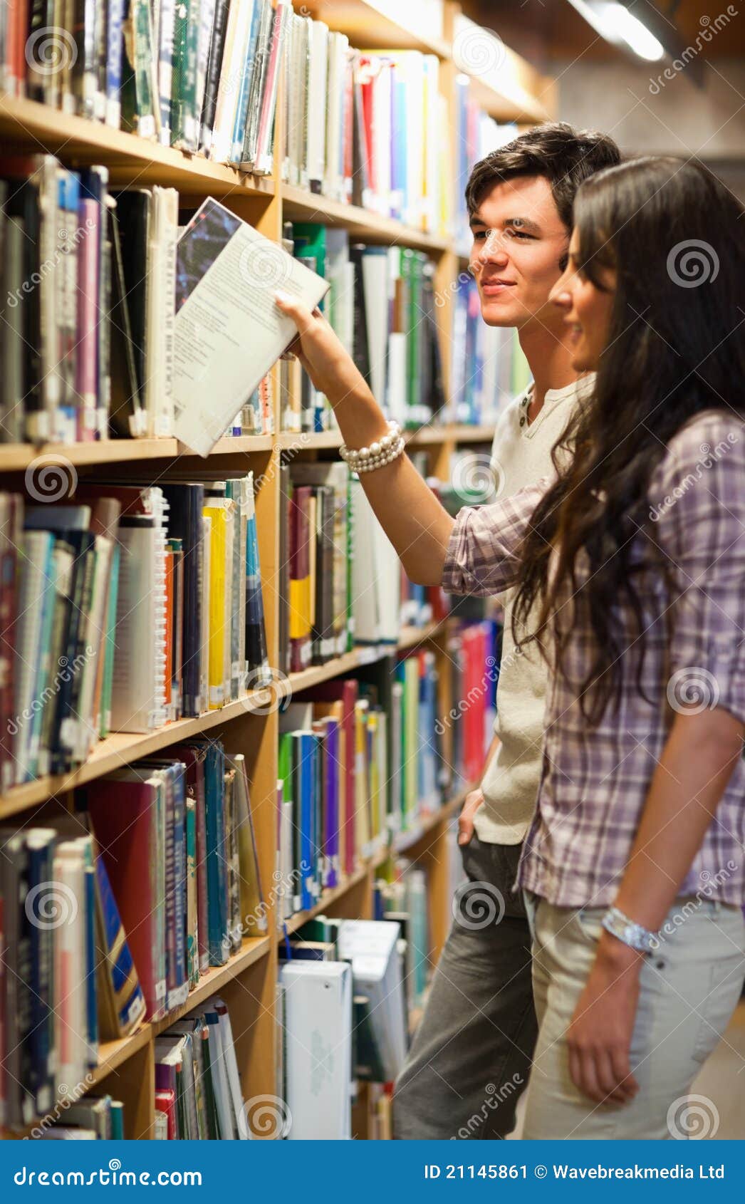 Portrait of Young Students Choosing a Book Stock Image - Image of boys ...