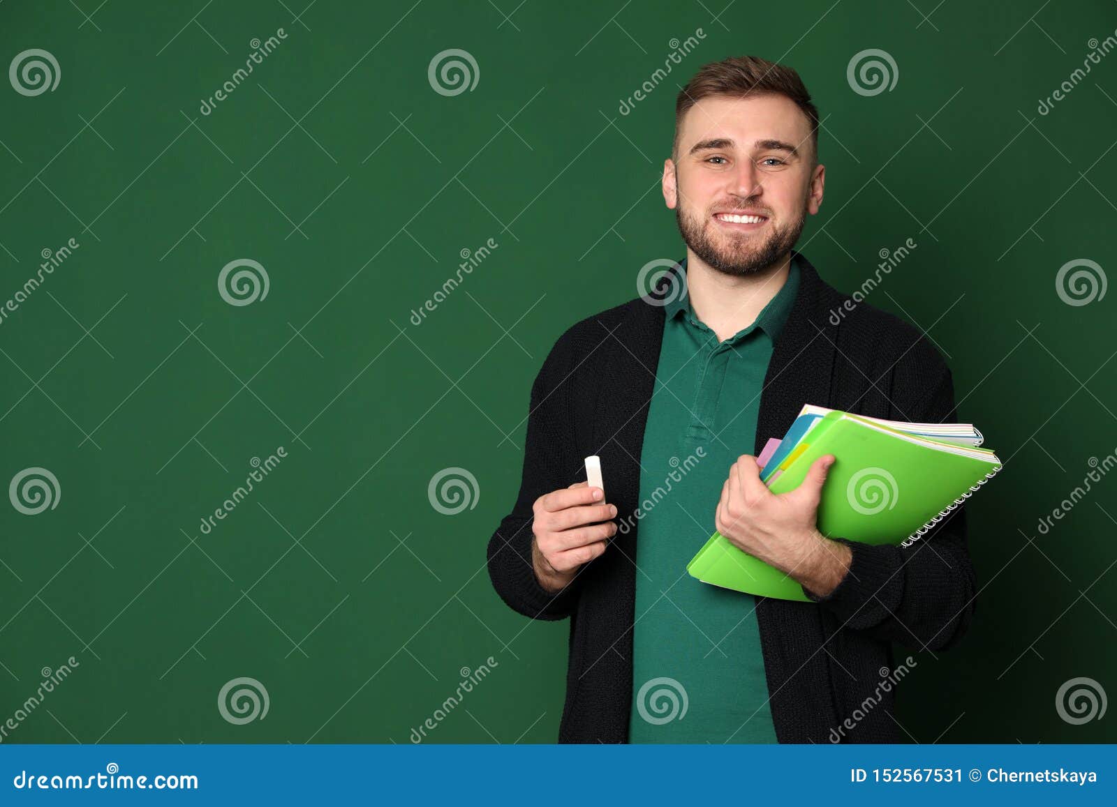 Portrait of Young Teacher with Notebooks and Chalk on Green Background ...