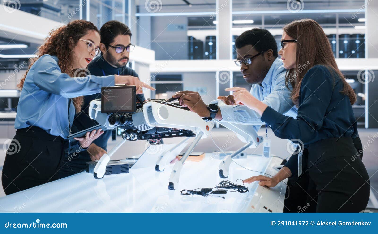 Portrait of a Young Team of Multicultural Engineers Use Computers ...