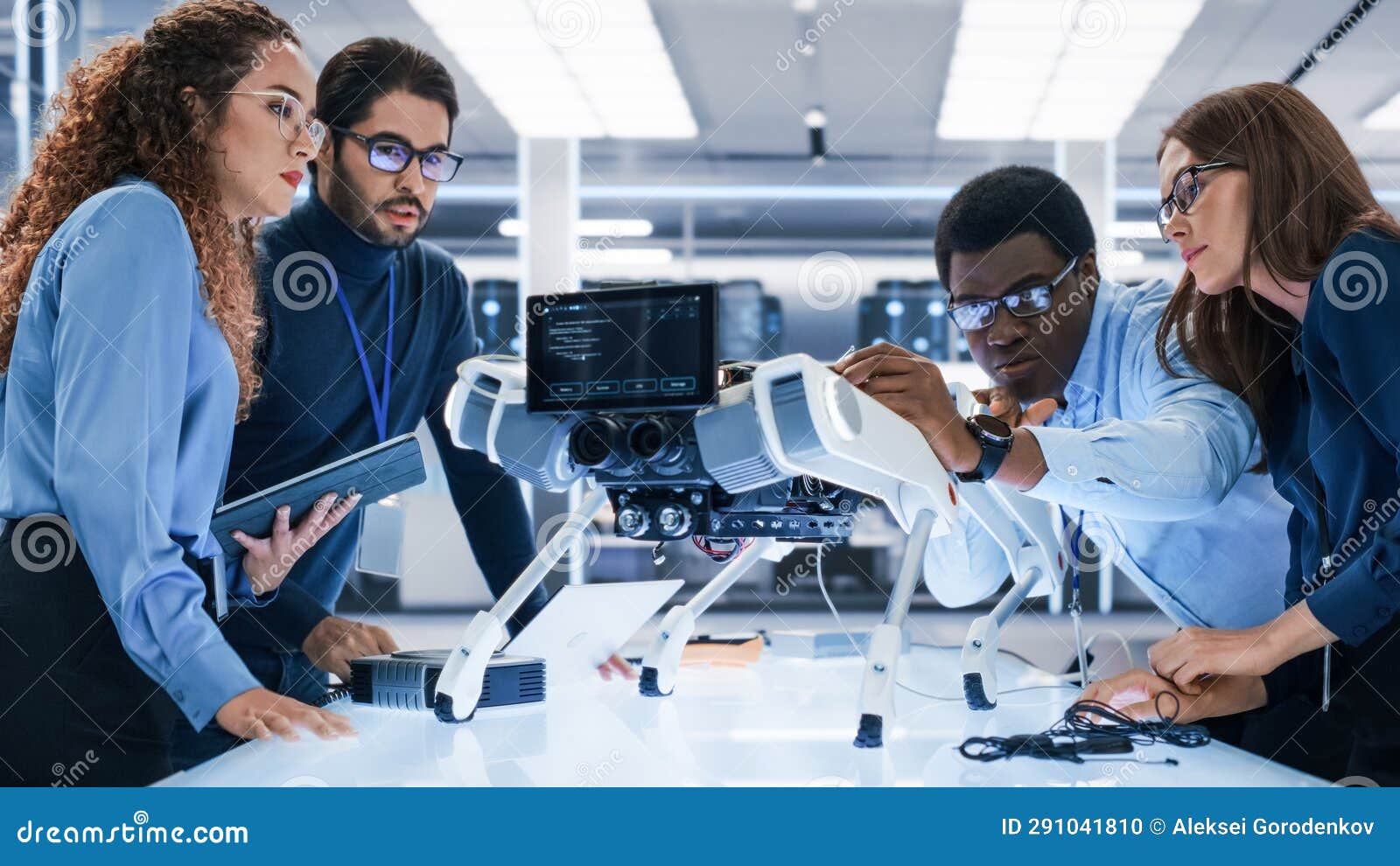 Portrait of a Young Team of Multicultural Engineers Use Computers ...