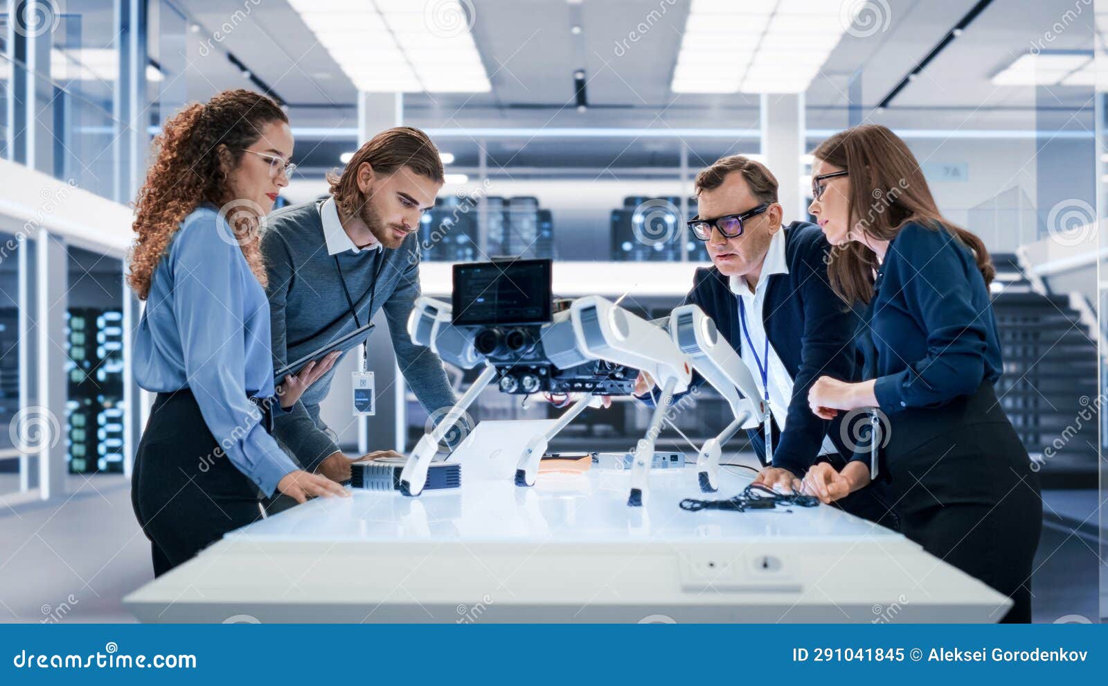 Portrait of a Young Team of Multicultural Engineers Use Computers ...