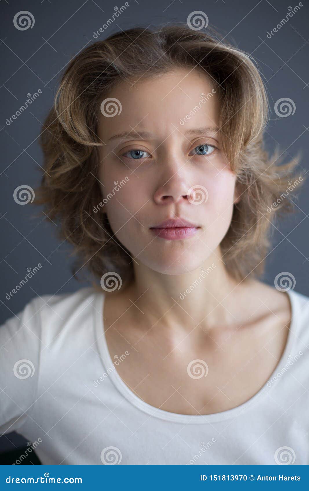 Portrait of Young Thoughtful Lady Smirkingly Looking in Camera Stock ...