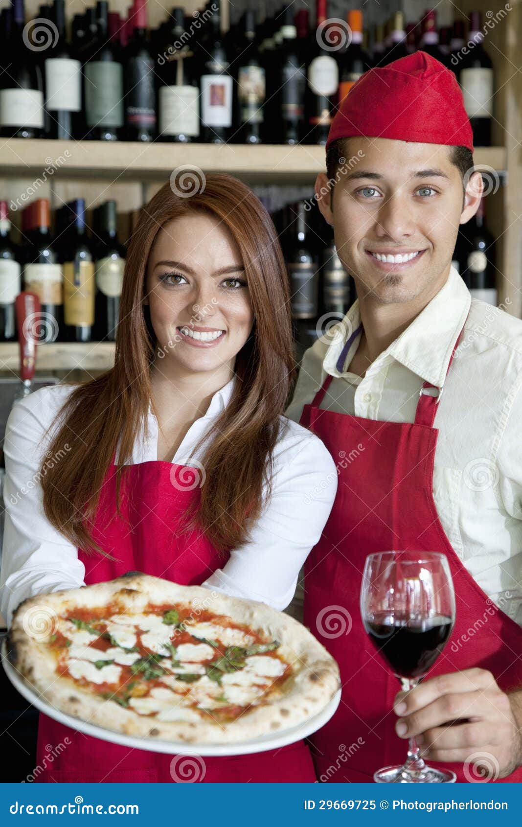 Portrait of a Young Wait Staff with Wine Glass and Pizza Stock Image ...