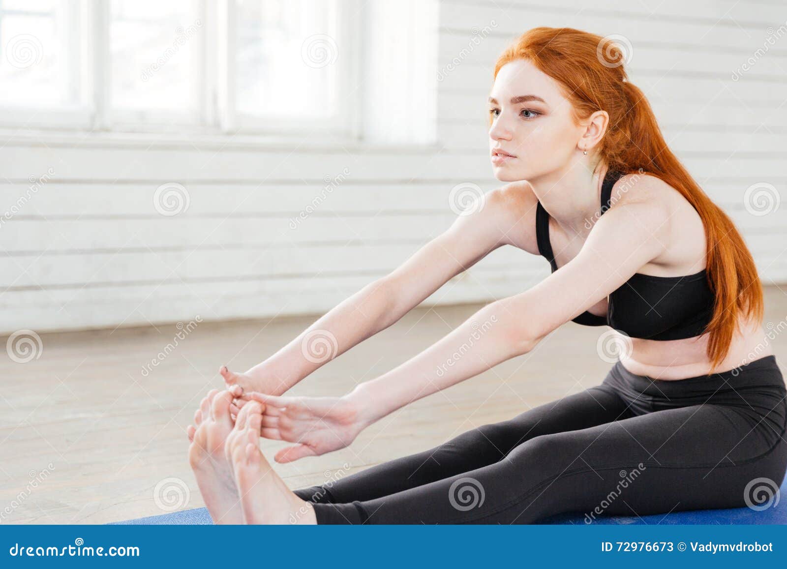 Portrait of Young Woman Doing Stretching Exercise Stock Image - Image ...