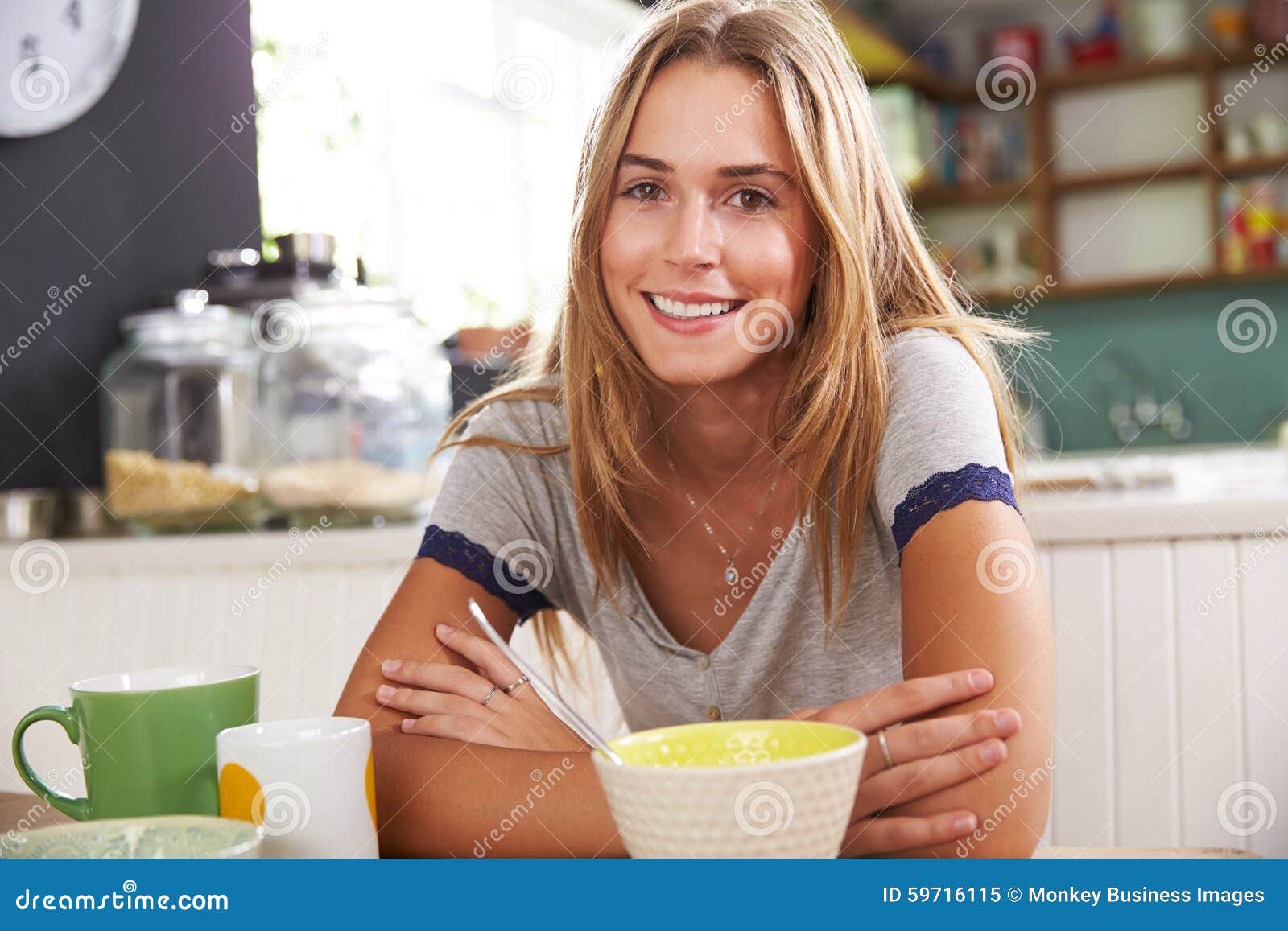 Portrait of Young Woman Eating Breakfast in Kitchen Stock Image - Image ...