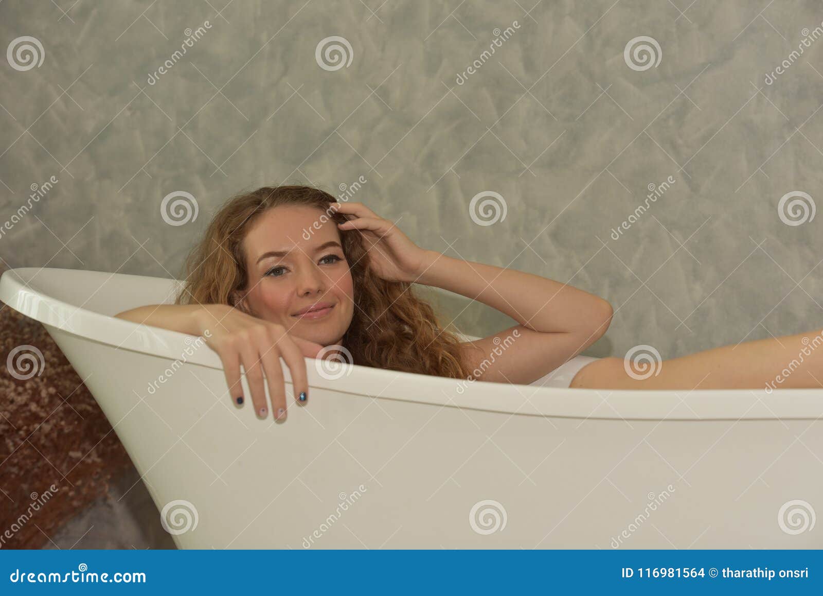 Portrait of a Young Woman Laying in Bathtub.relaxed Time in Bathroom ... Portrait of a Young Woman Laying in Bathtub.relaxed Time in Bathroom ...
