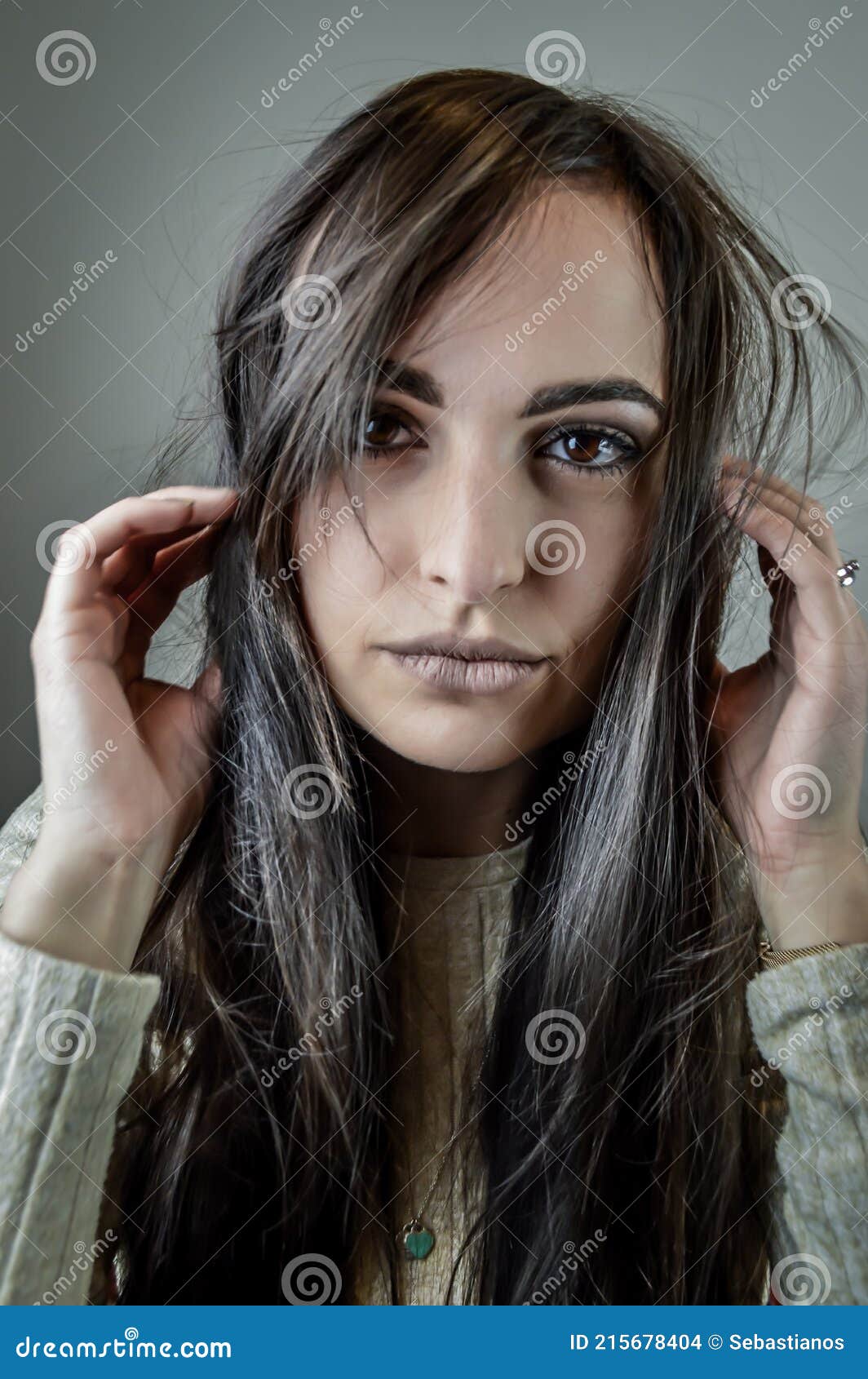 Portrait Of A Young Woman With Long Brown Hair And A Captivating And