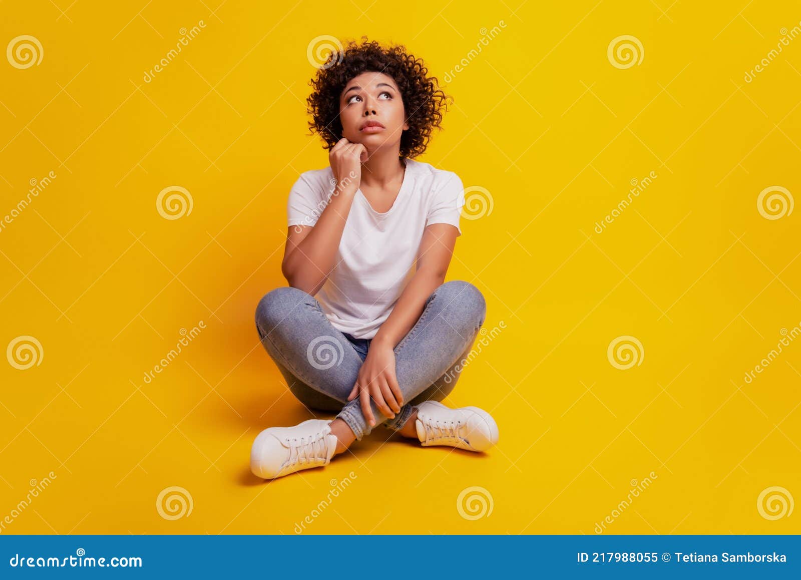 Portrait Of Young Woman Pondering Over Something Sit Floor Look Up