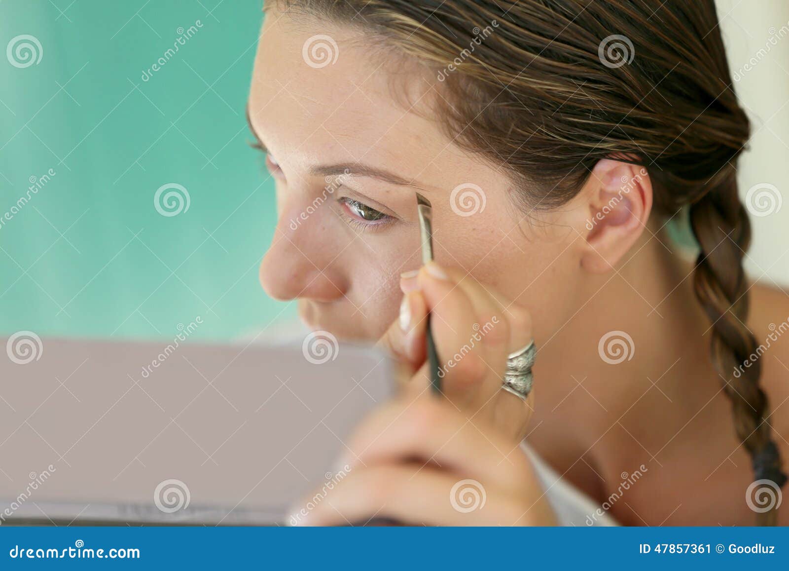 Portrait of a Young Woman Putting Makeup on Stock Image - Image of ...